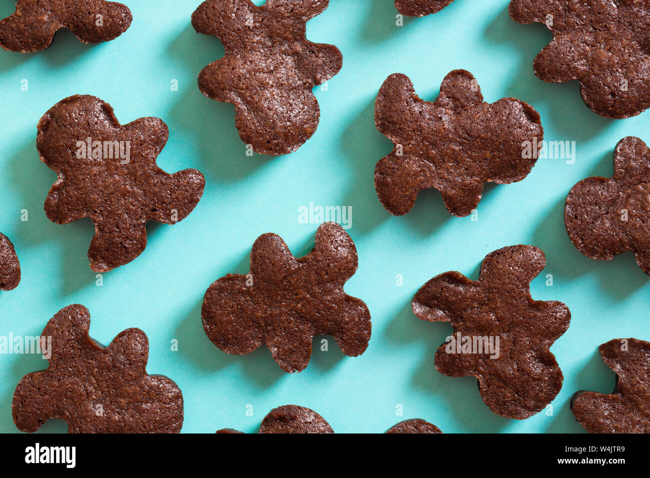 Gingerbread Shaped Brownies on a Teal Background Stock Photo - Alamy