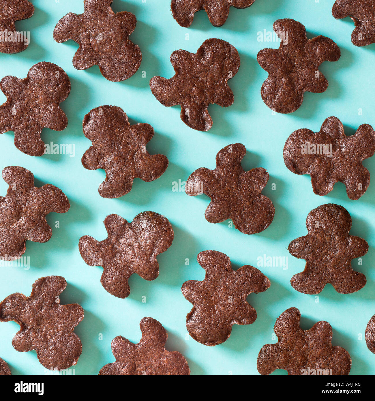 Gingerbread Shaped Brownies on a Teal Background Stock Photo - Alamy