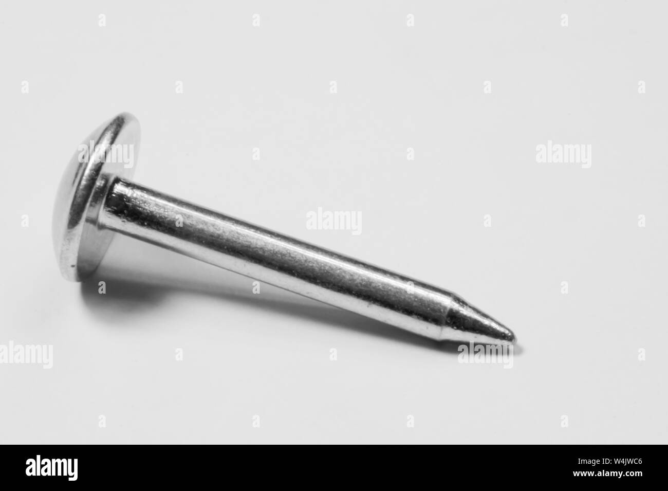 Metal nail isolated on white Stock Photo - Alamy