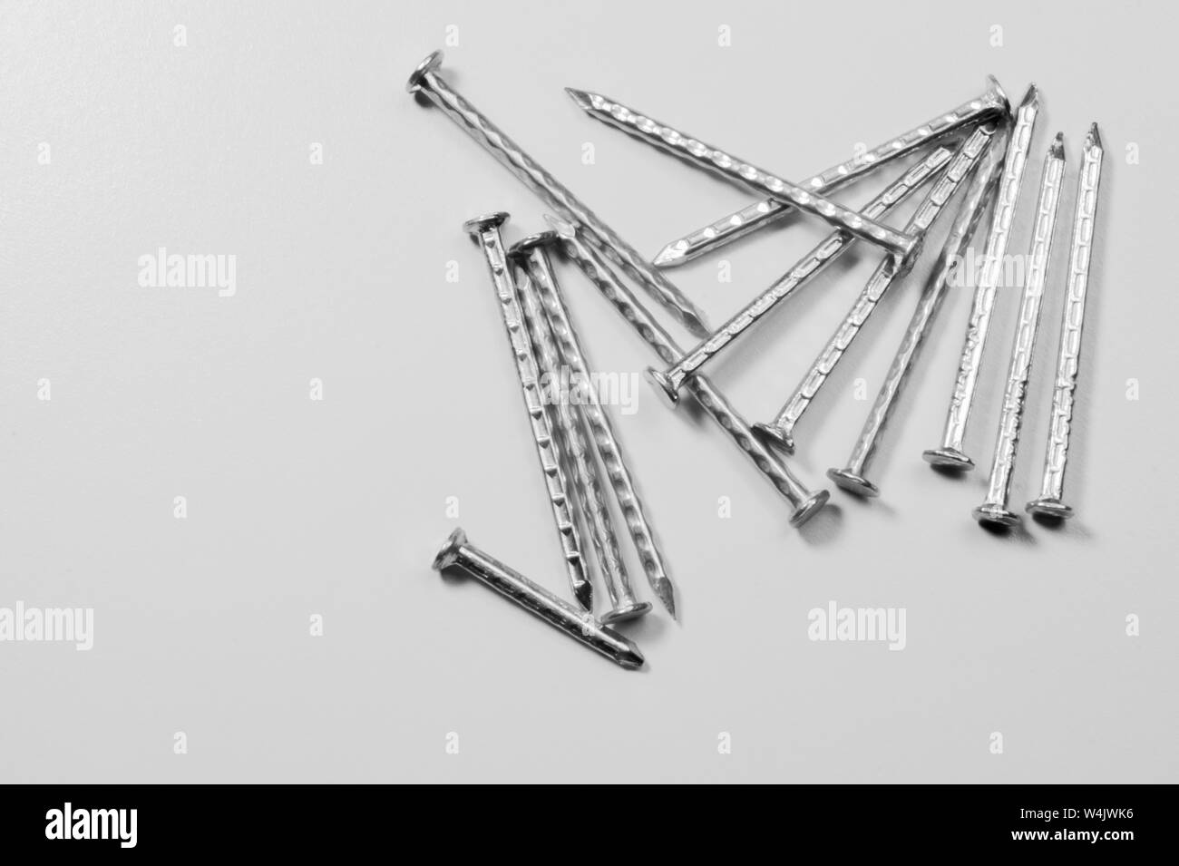 Metal nails isolated on white background Stock Photo - Alamy