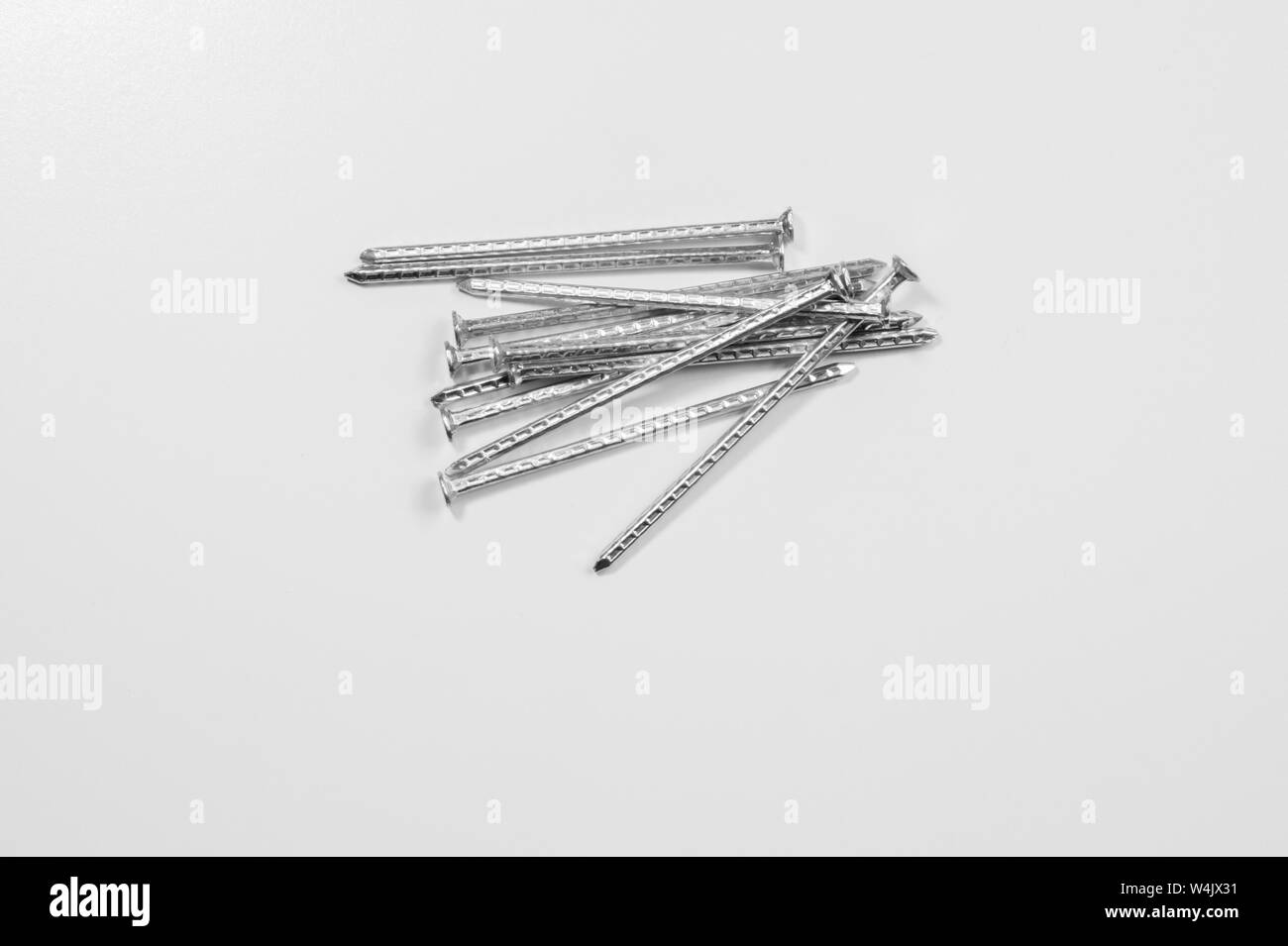 Metal nails isolated on white background Stock Photo - Alamy
