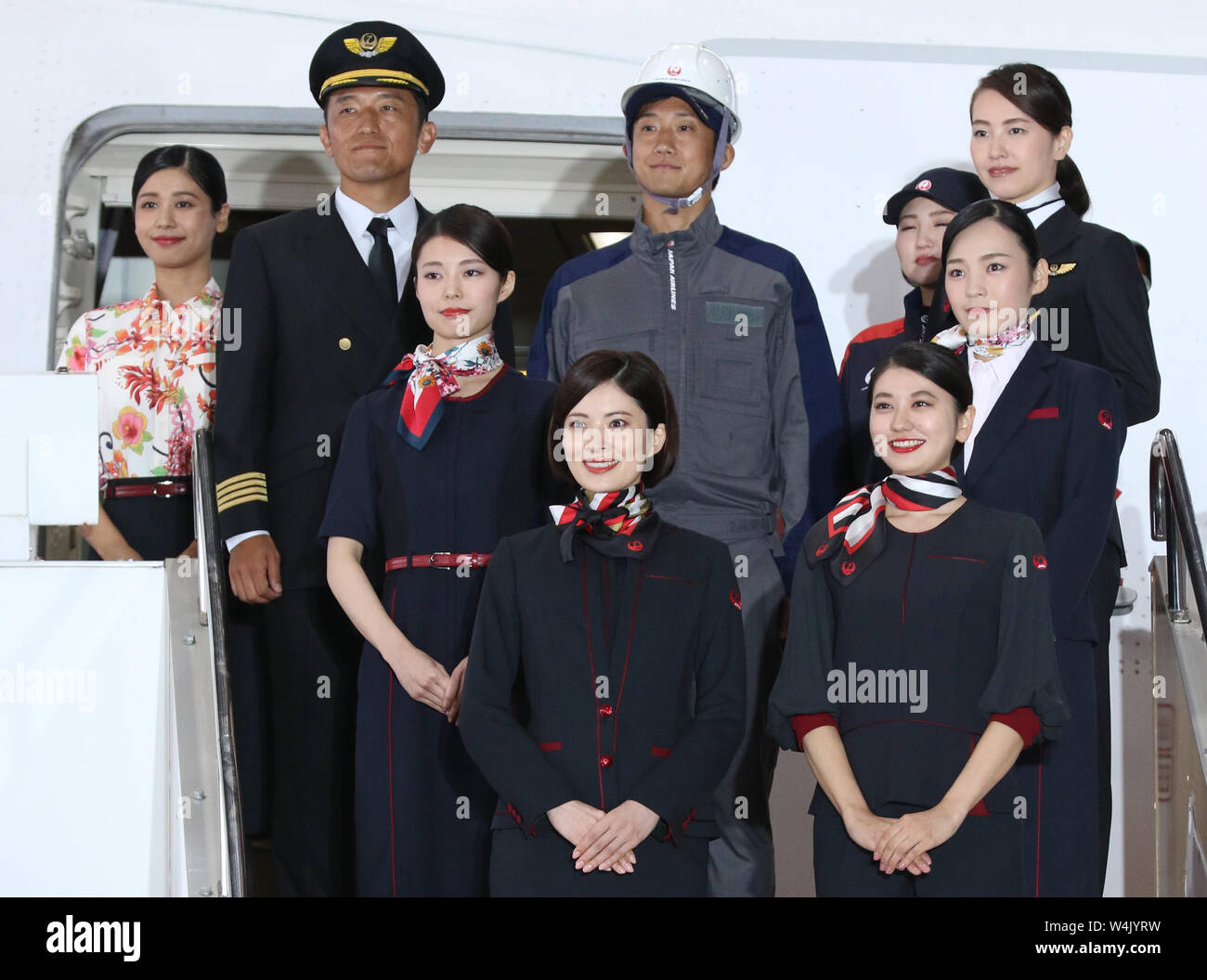 Tokyo, Japan. 23rd July, 2019. Japan Airlines (JAL) staffs pose for ...