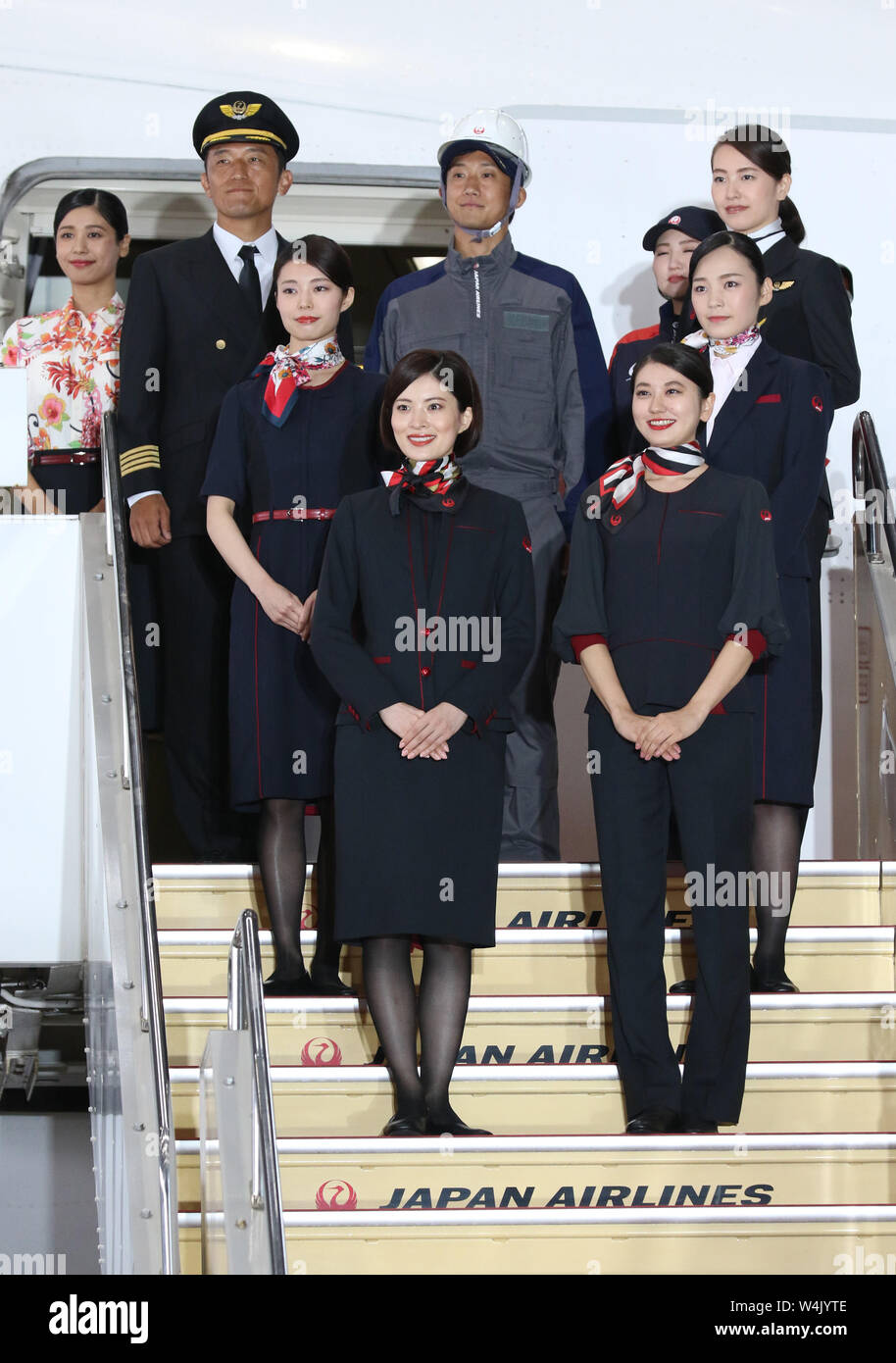 Tokyo, Japan. 23rd July, 2019. Japan Airlines (JAL) staffs pose for ...