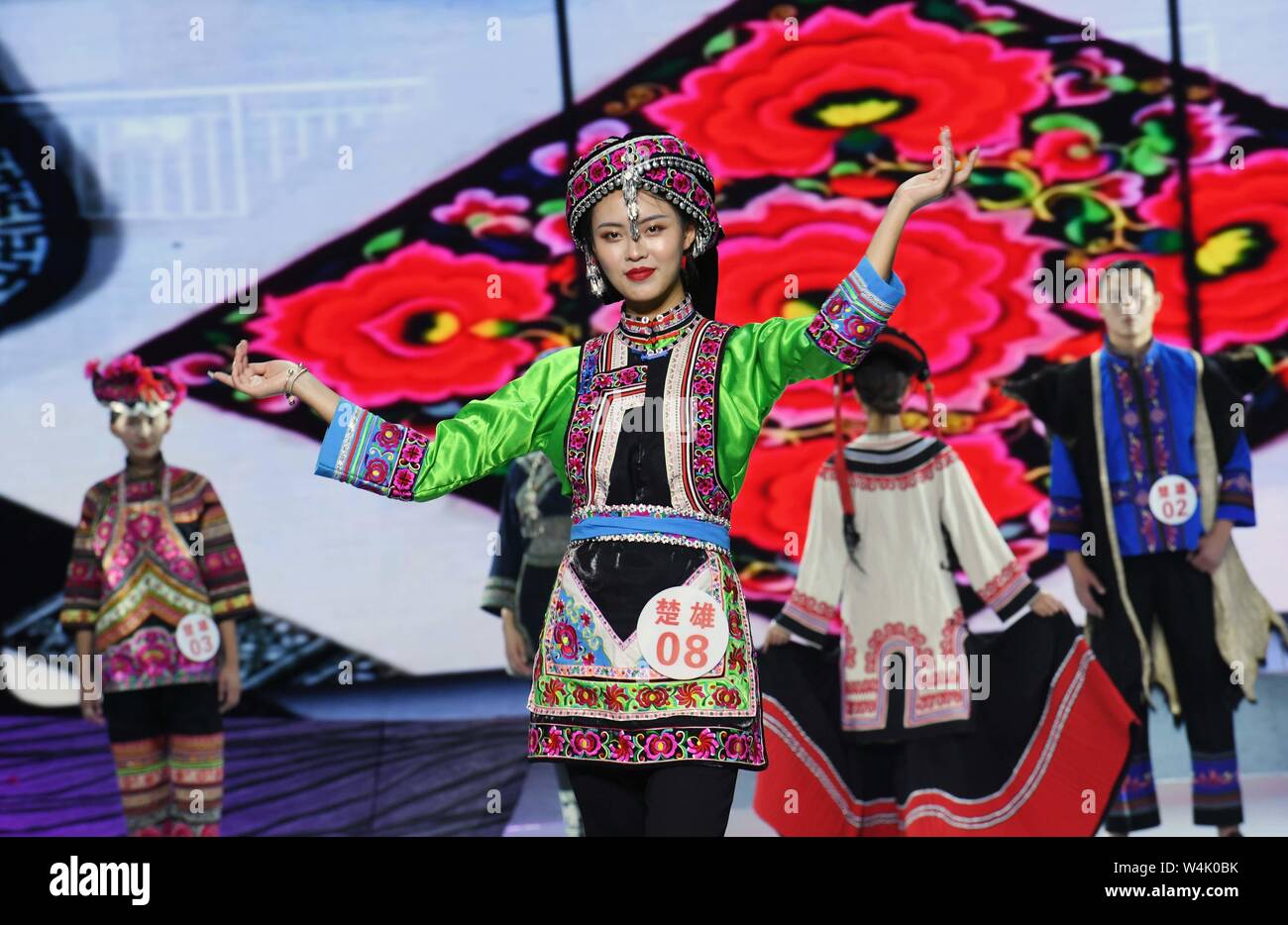 Chuxiong, China's Yunnan Province. 23rd July, 2019. Models present ...