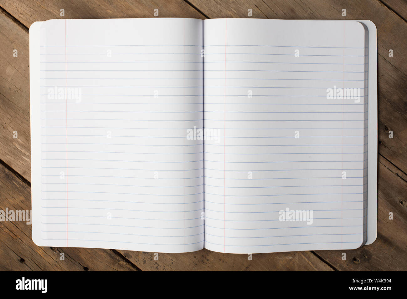 Open blank composition book on a weathered wood background Stock Photo ...