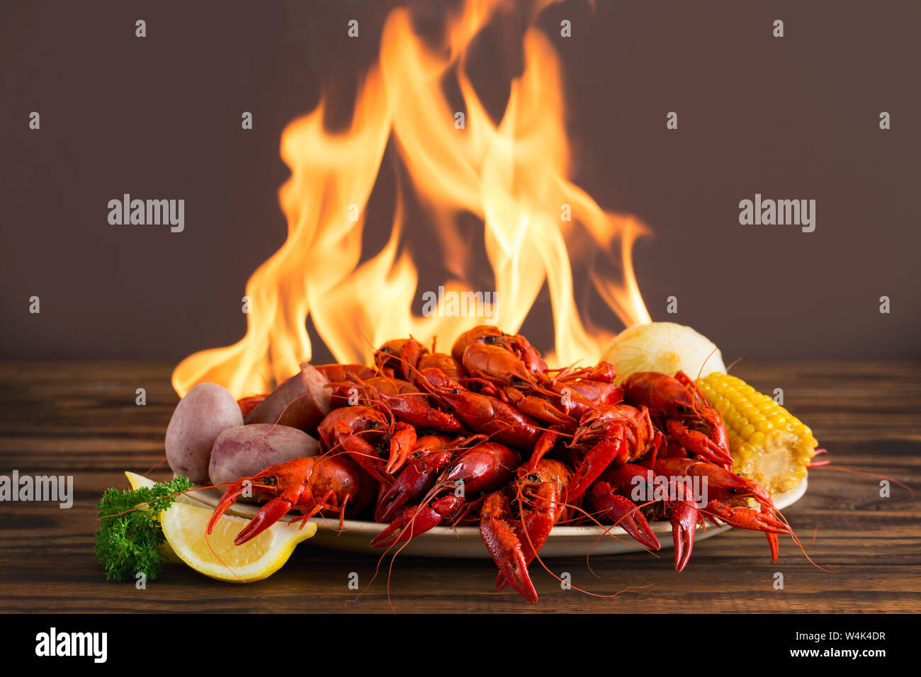 Spicy Boiled Crawfish with Flames Stock Photo - Alamy