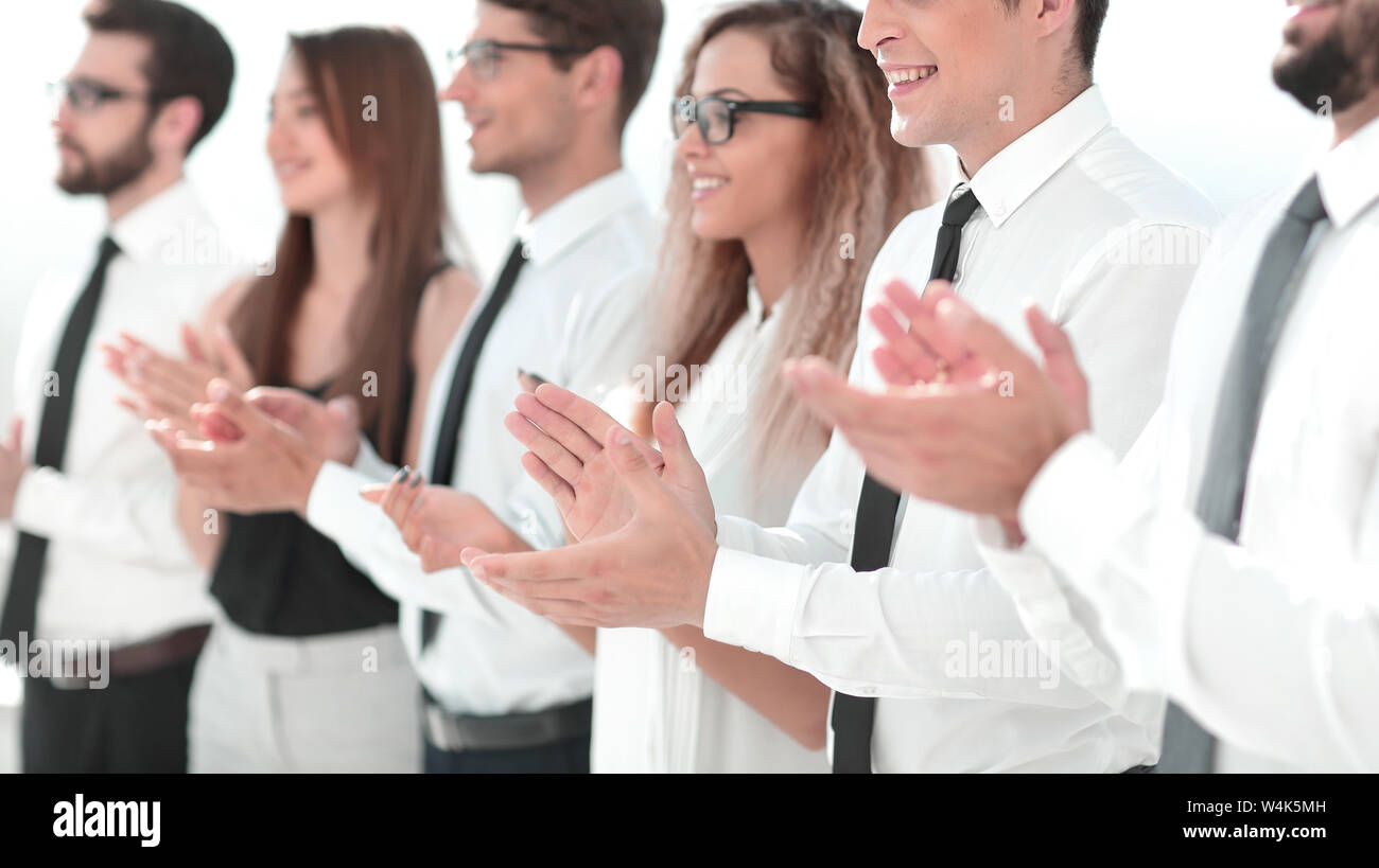 close up.staff a standing ovation in the office Stock Photo - Alamy