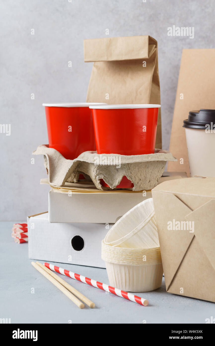 Kraft paper eco-friendly food packaging and tableware on gray ...