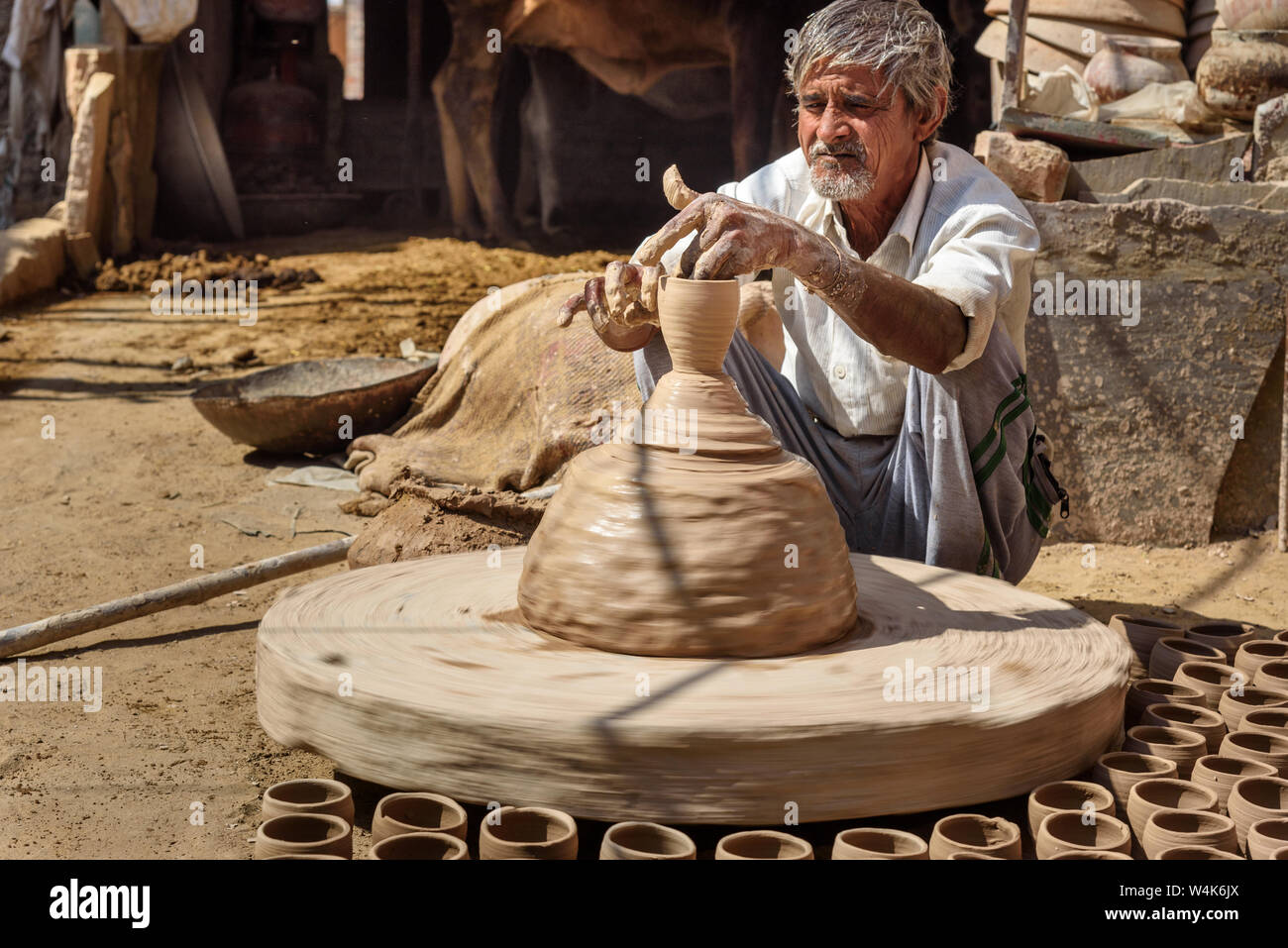 Bikaner, India - February 12, 2019: Indian potter making clay pots on ...