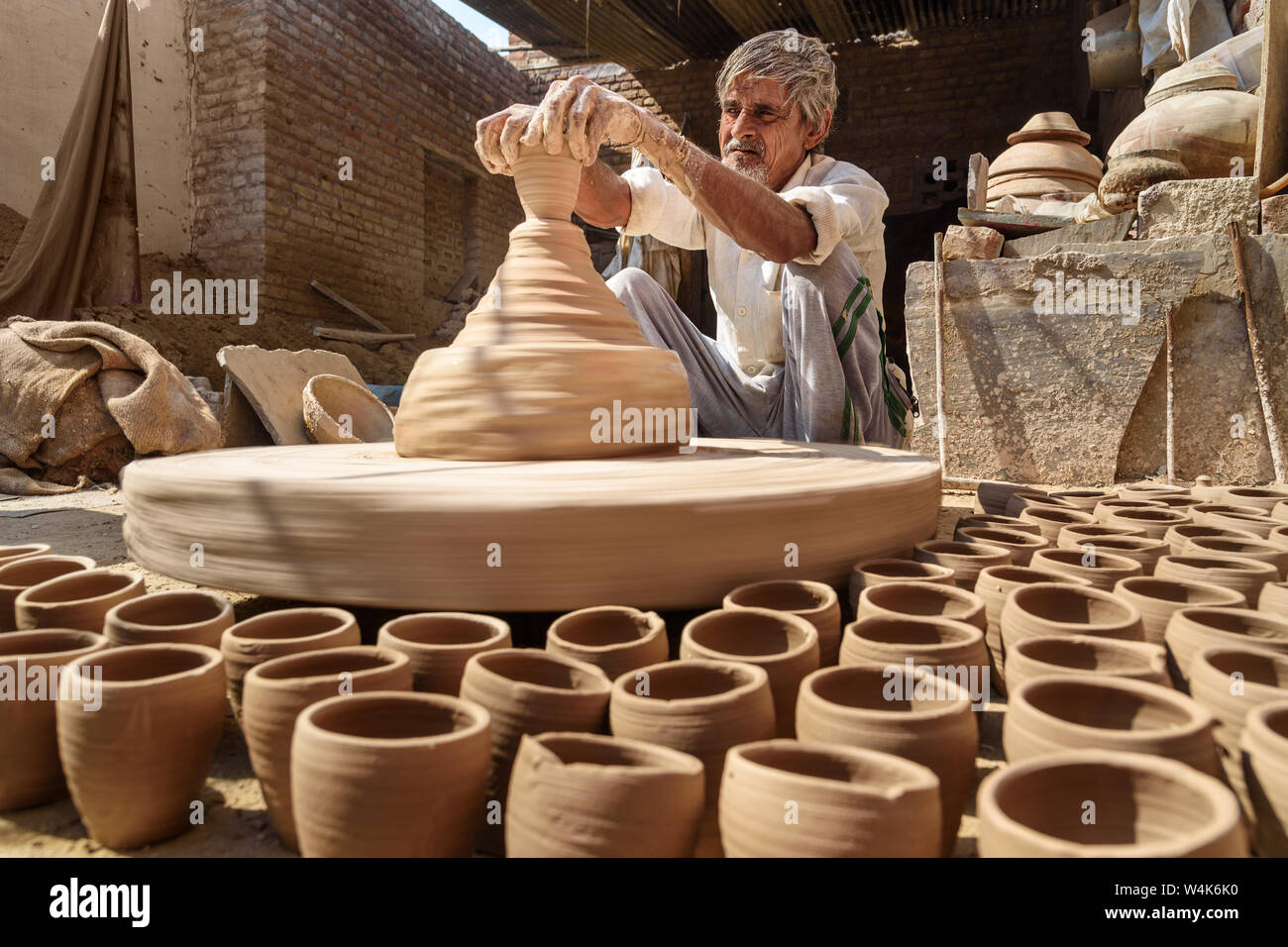 Bikaner, India - February 12, 2019: Indian potter making clay pots on ...
