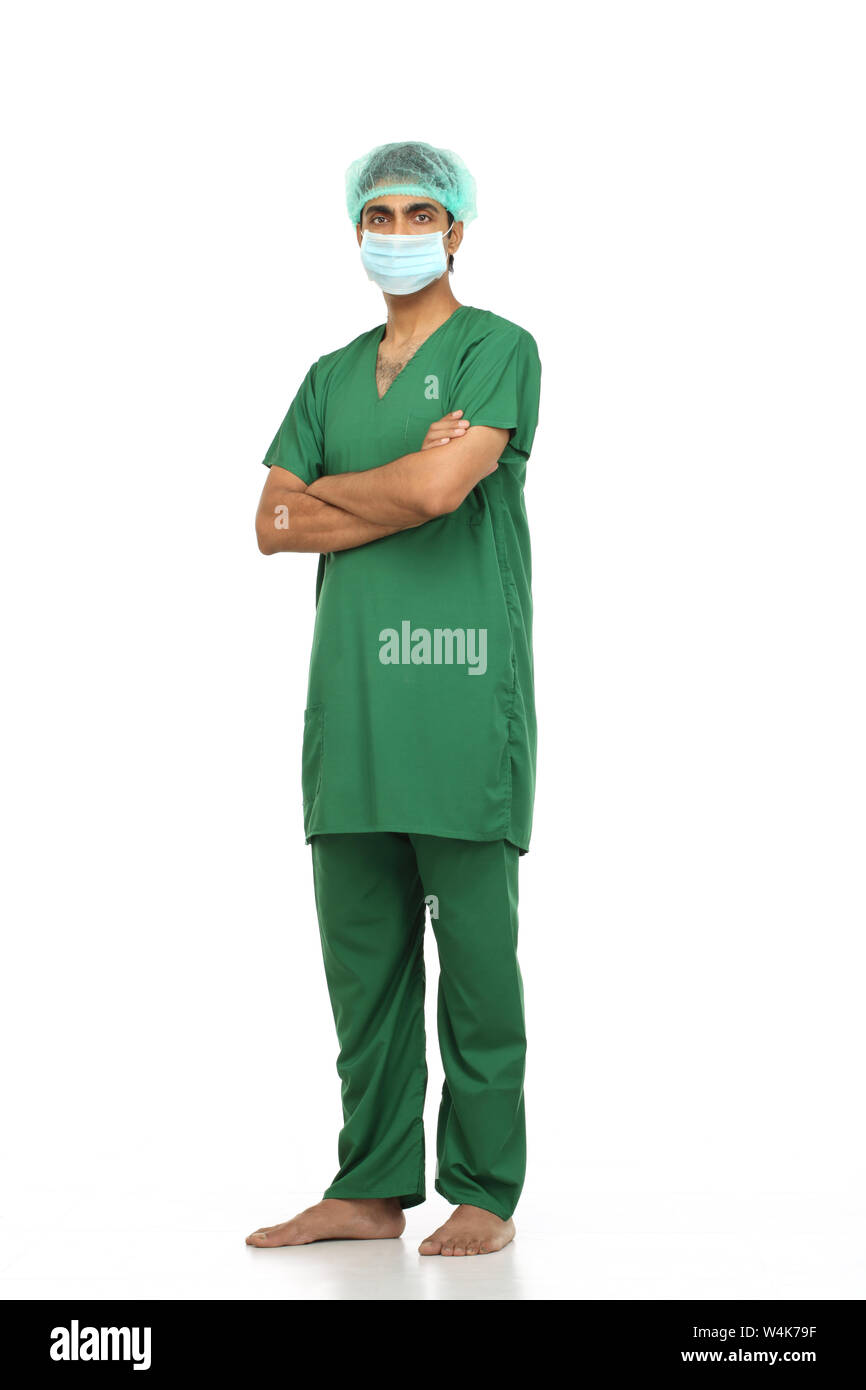 Male surgeon standing with his arms crossed Stock Photo - Alamy