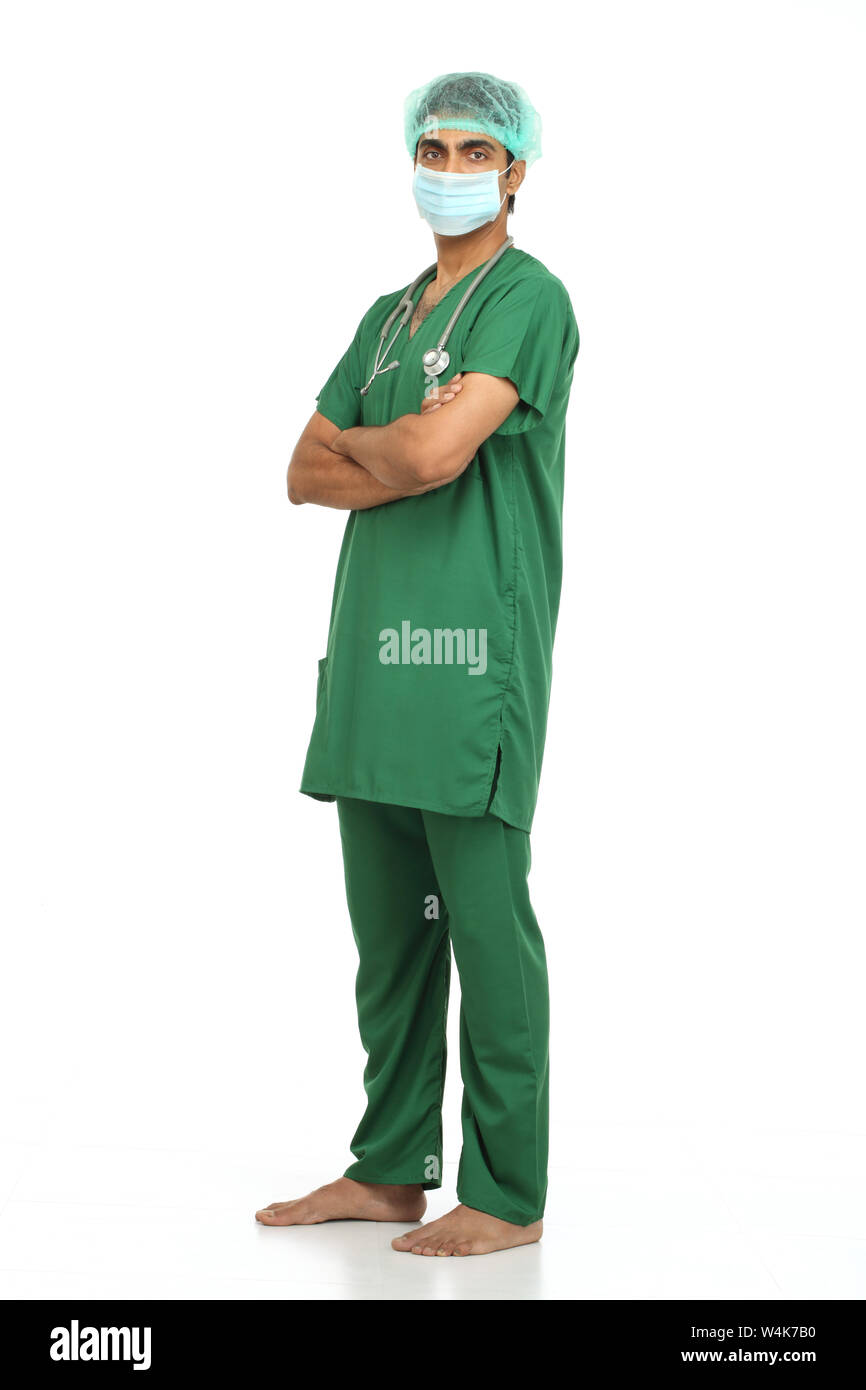 Surgeon standing with his arms crossed Stock Photo - Alamy