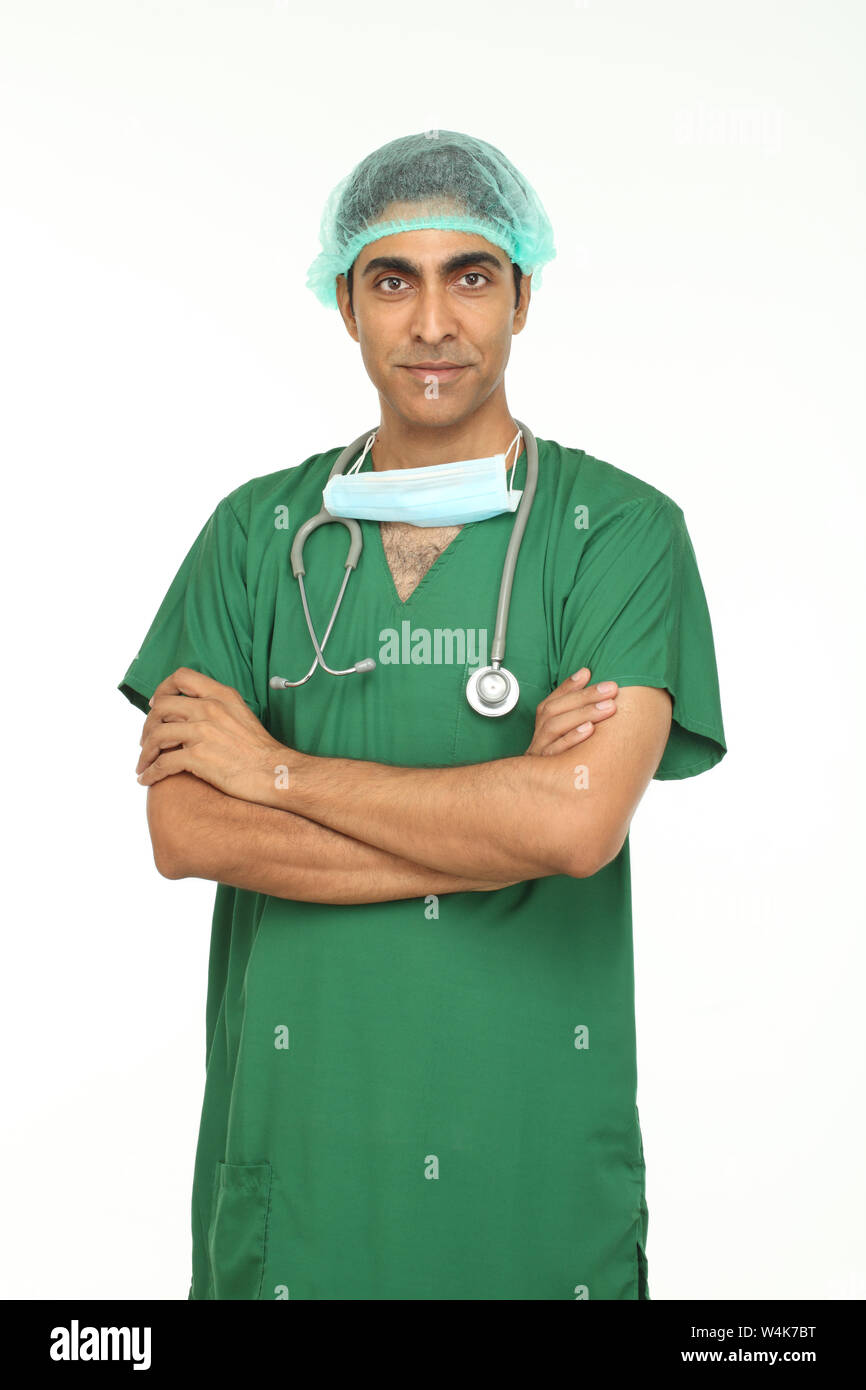 Surgeon standing with his arms crossed Stock Photo - Alamy
