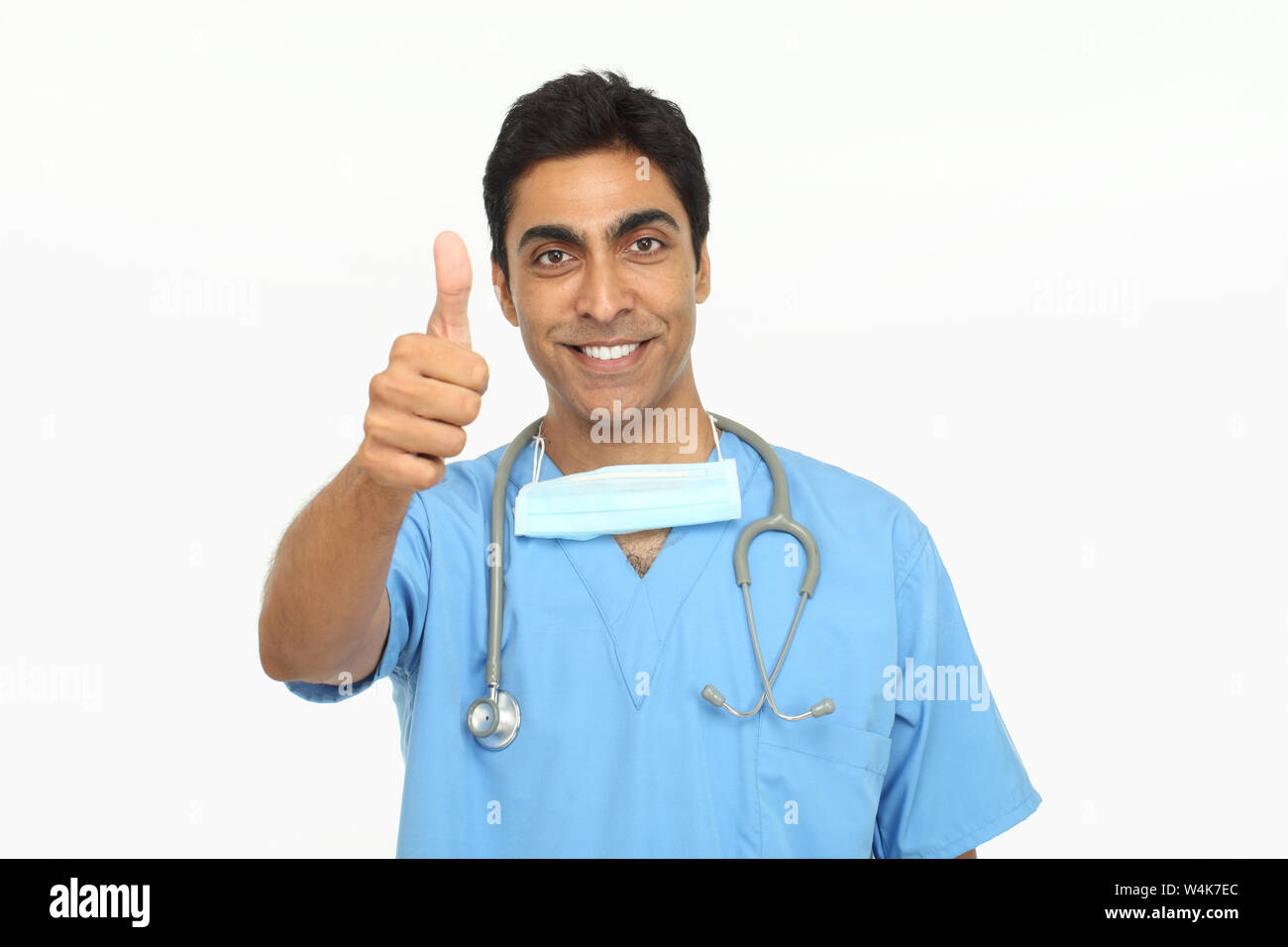 Male surgeon showing thumbs up sign and smiling Stock Photo - Alamy