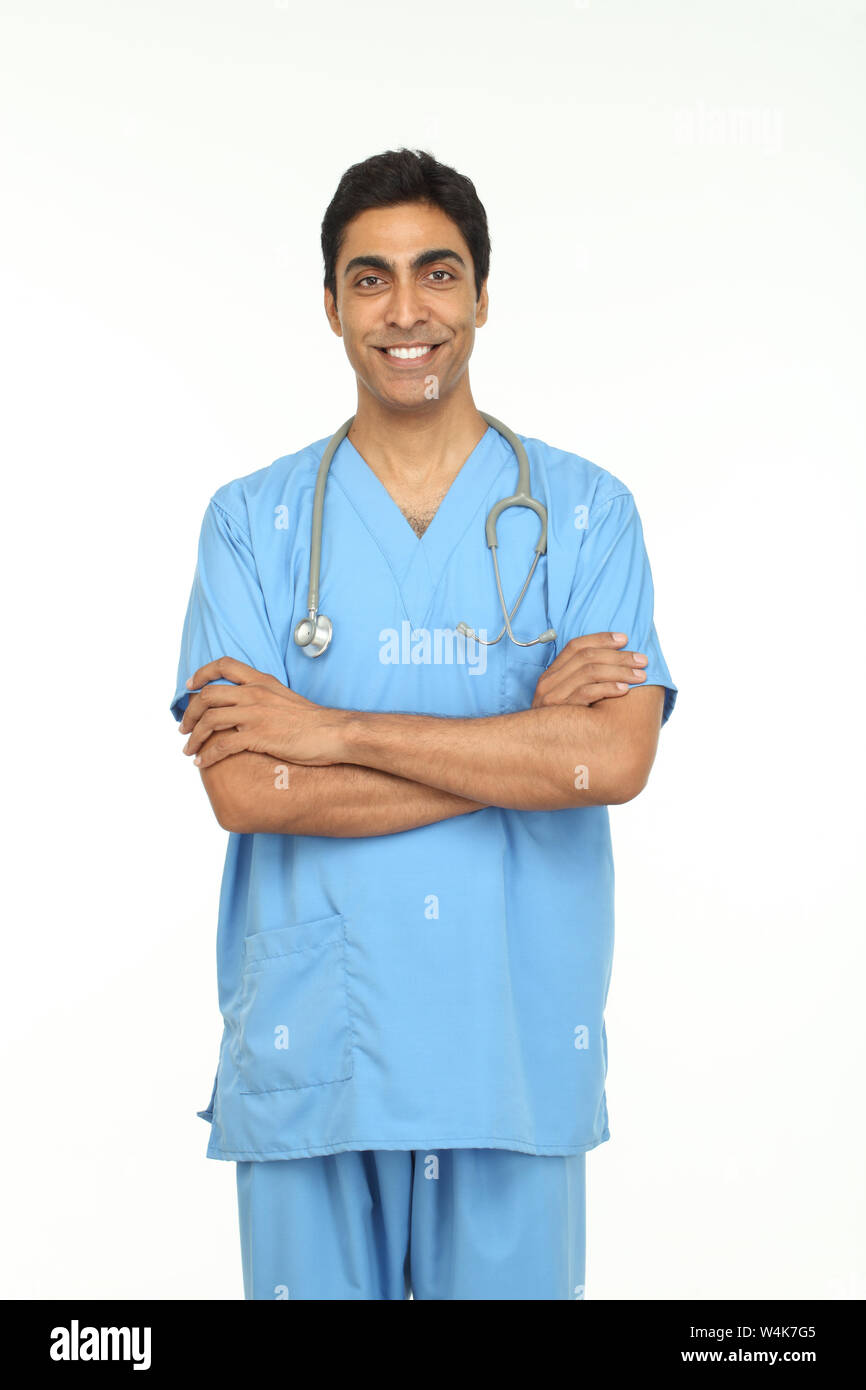 Surgeon smiling with his arms crossed Stock Photo - Alamy