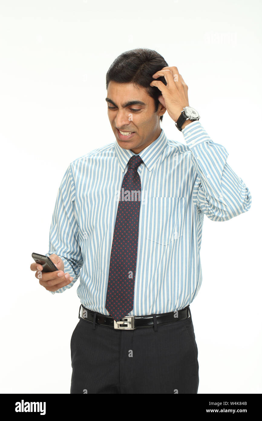 Man scratching head out frustration hi-res stock photography and images ...