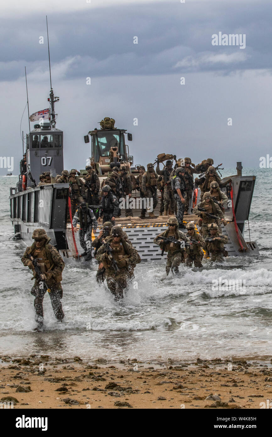 U.S. Marines come off an Australian Navy landing craft onto Kings Beach ...