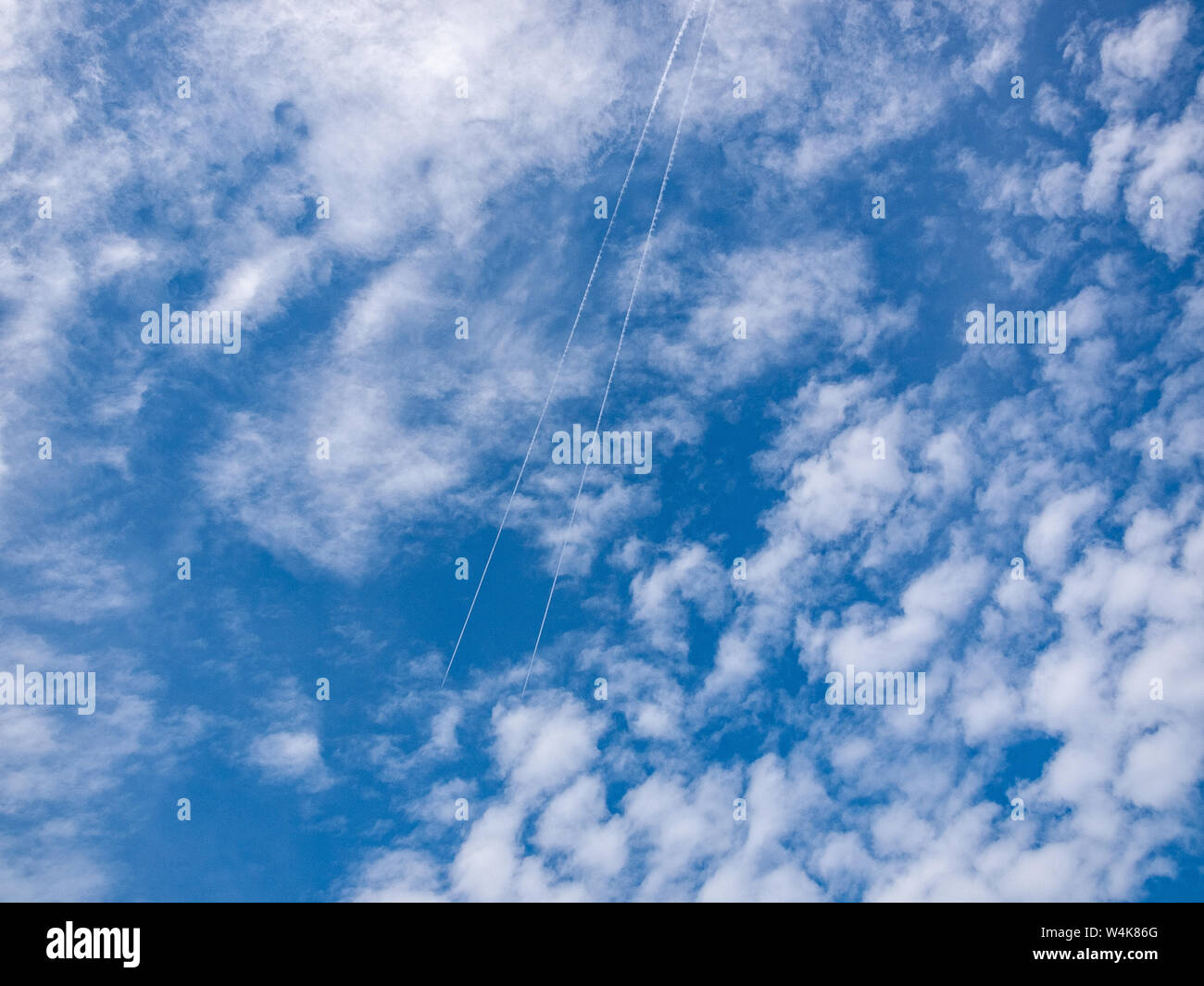 F22 Fighter Jets flying and leaving contrails in the Alaska Sky Stock ...
