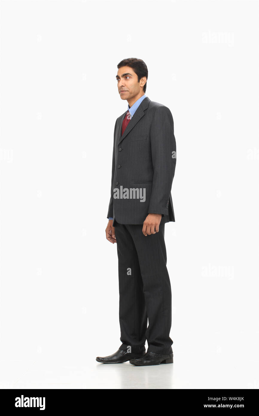 Side profile of a businessman standing Stock Photo - Alamy