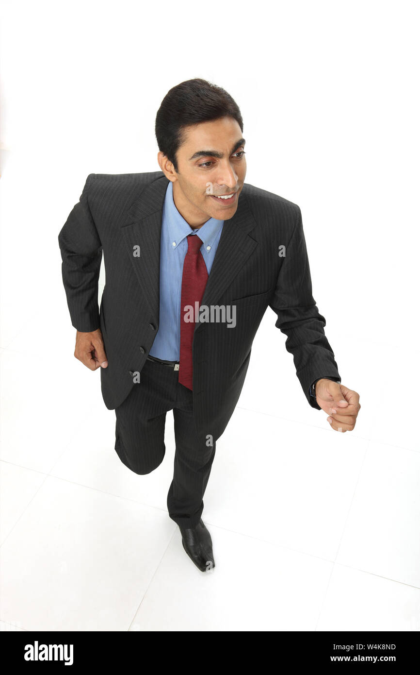 Indian businessman running hi-res stock photography and images - Alamy