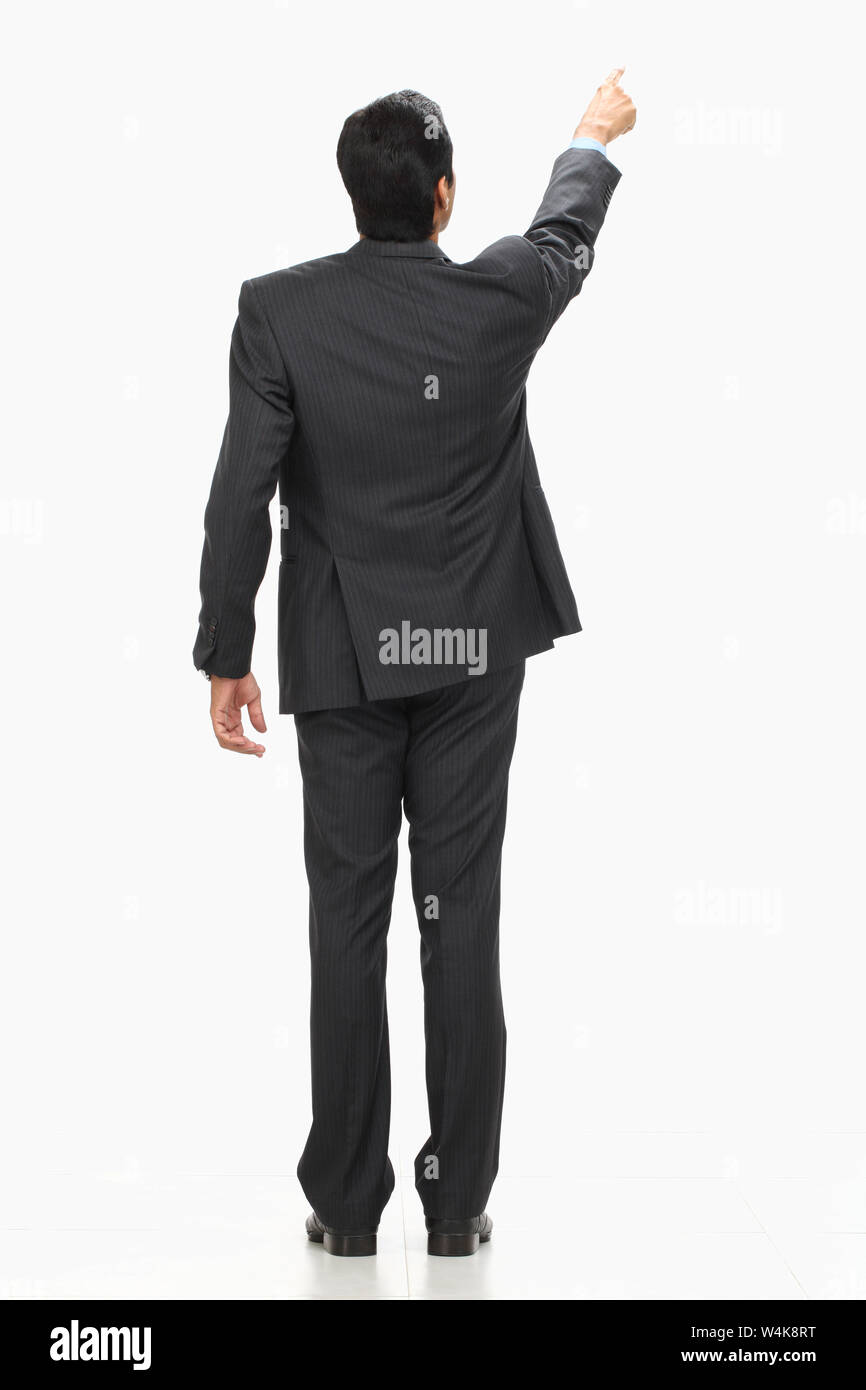 Rear view of a businessman pointing Stock Photo - Alamy