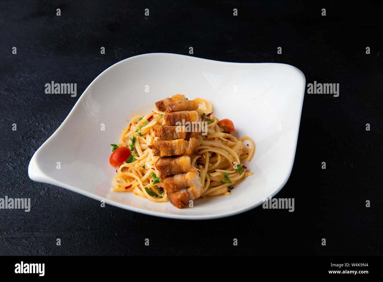 crispy Pork belly spaghetti with background Stock Photo - Alamy