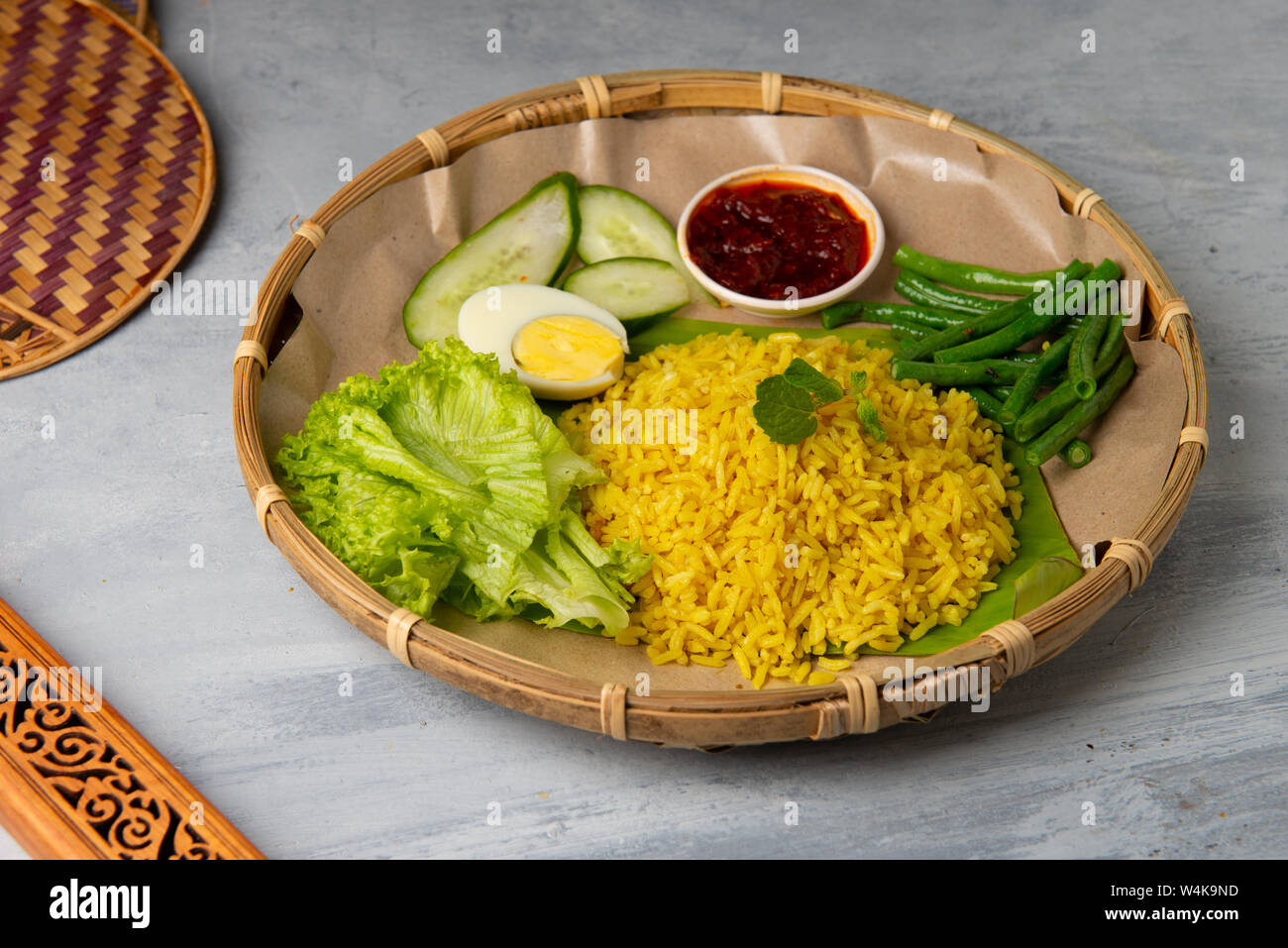 malaysian style turmeric rice in traditional settings Stock Photo - Alamy