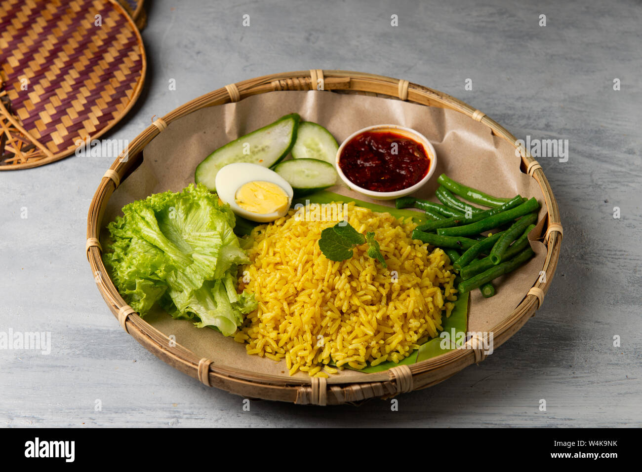 malaysian style turmeric rice in traditional settings Stock Photo - Alamy