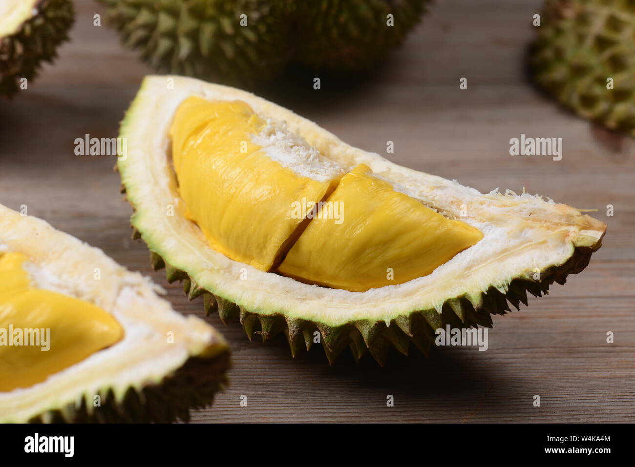 Durian riped and fresh ,durian peel with yellow colour on wooden table Stock Photo - Alamy