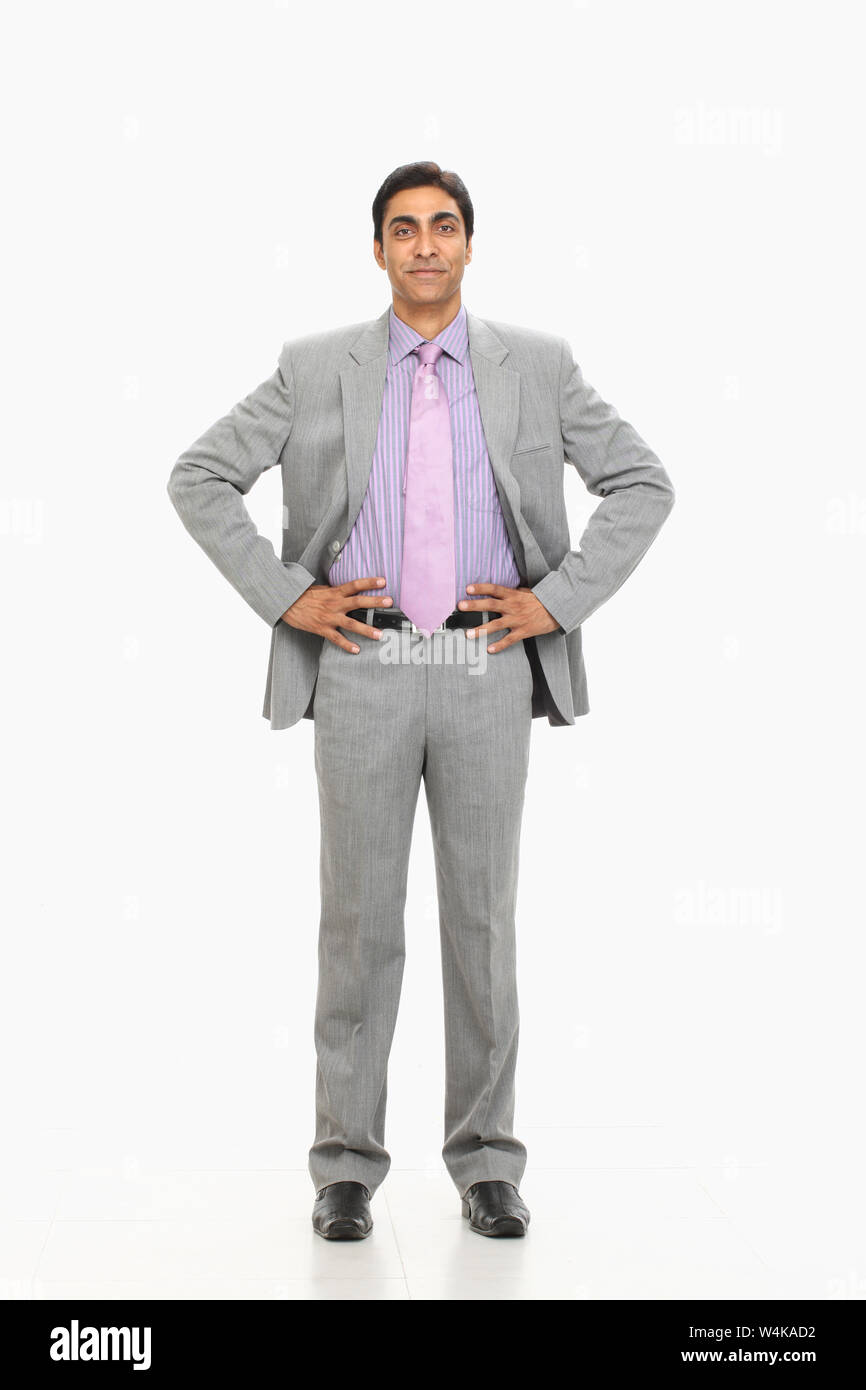 Businessman standing arms akimbo hi-res stock photography and images ...