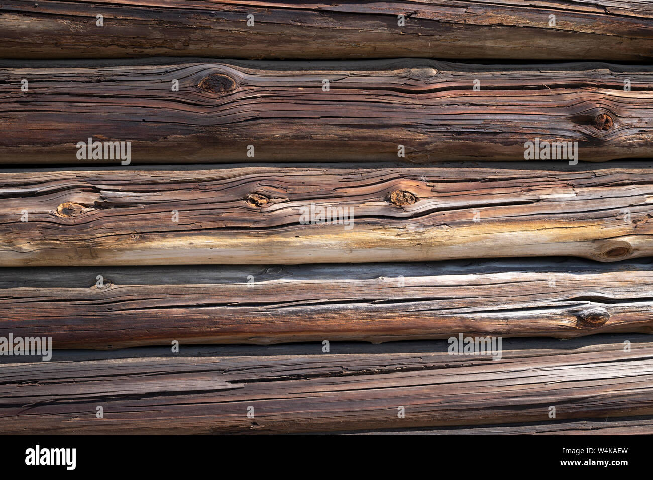 Background texture of old weathered wood cladding on a wall with ...