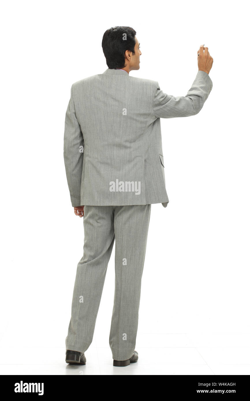 Indian businessman writing with a marker Stock Photo - Alamy