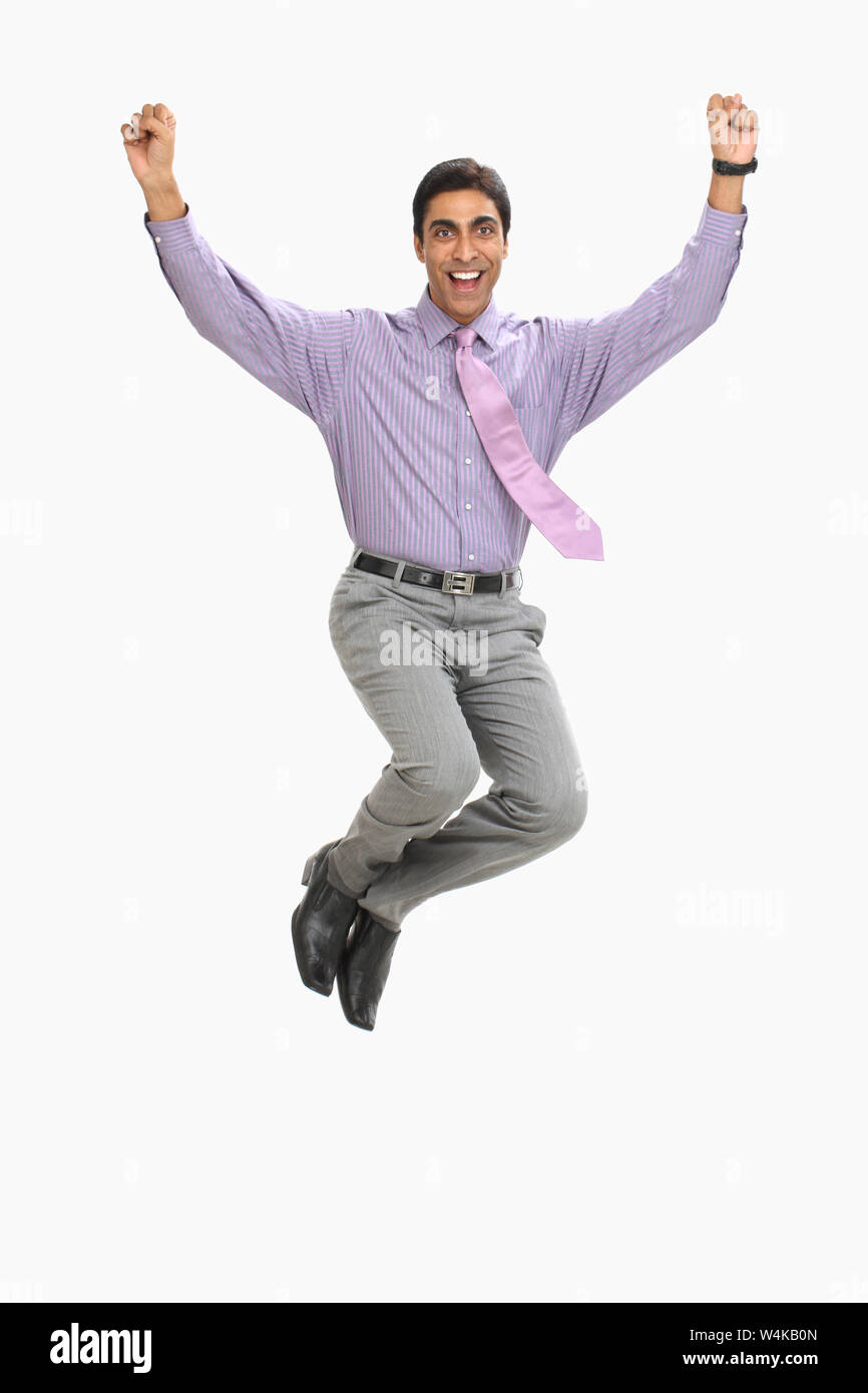 Businessman jumping the air Stock Photo - Alamy