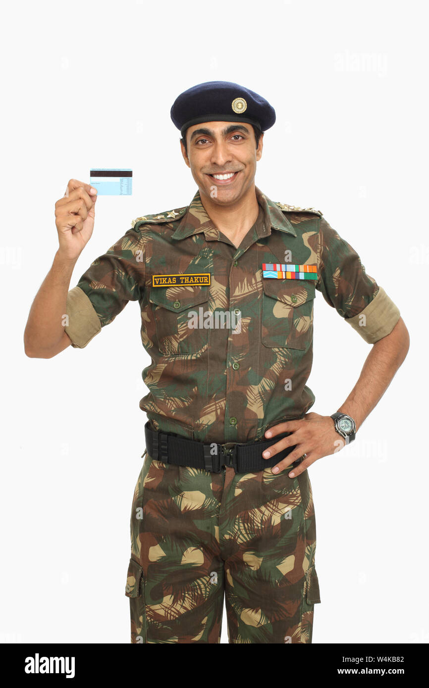 Army soldier showing a credit card Stock Photo - Alamy