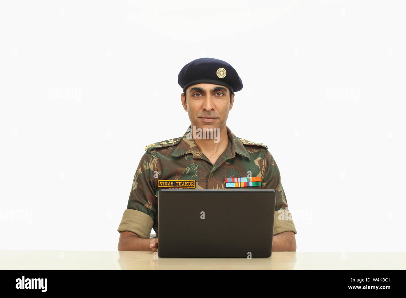 Indian Army Soldier working on a laptop Stock Photo - Alamy