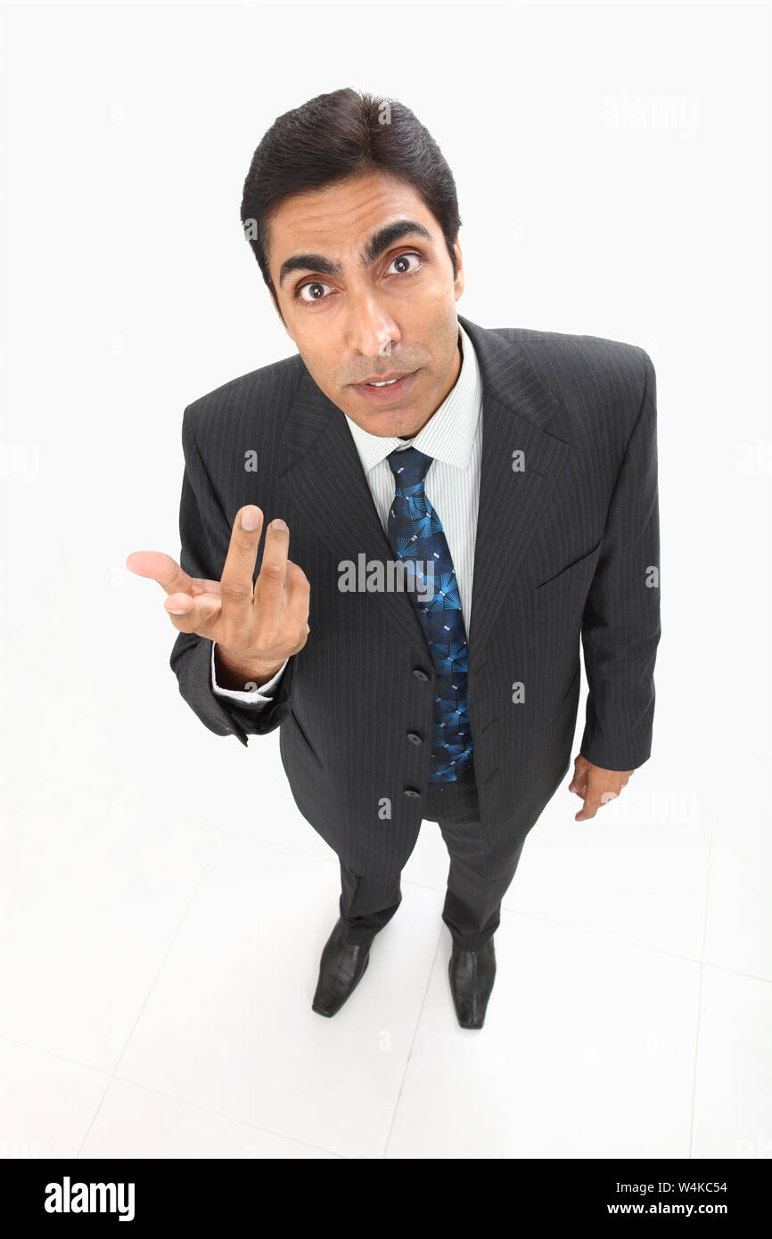 Businessman with questioning look Stock Photo - Alamy