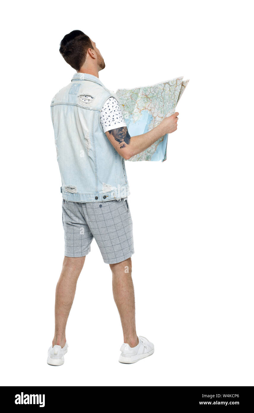 Back view of journey young man looking at the map. man in outdoor ...
