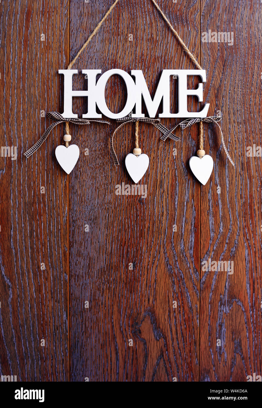 Word HOME, white letters with hearts on vintage board background with ...