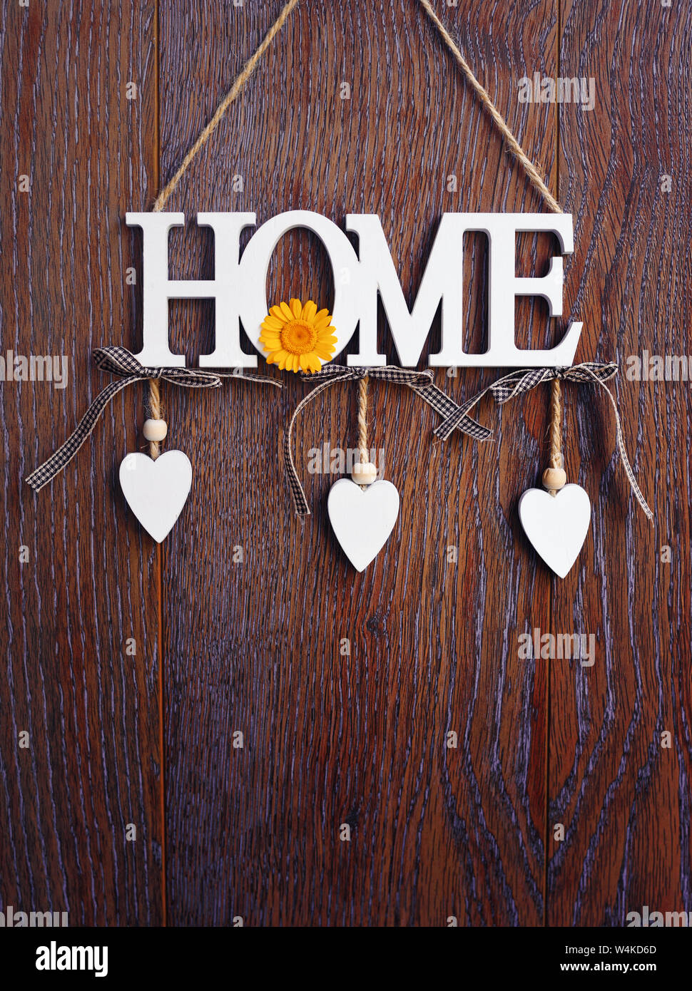 Word HOME, white letters with hearts on vintage board background with ...