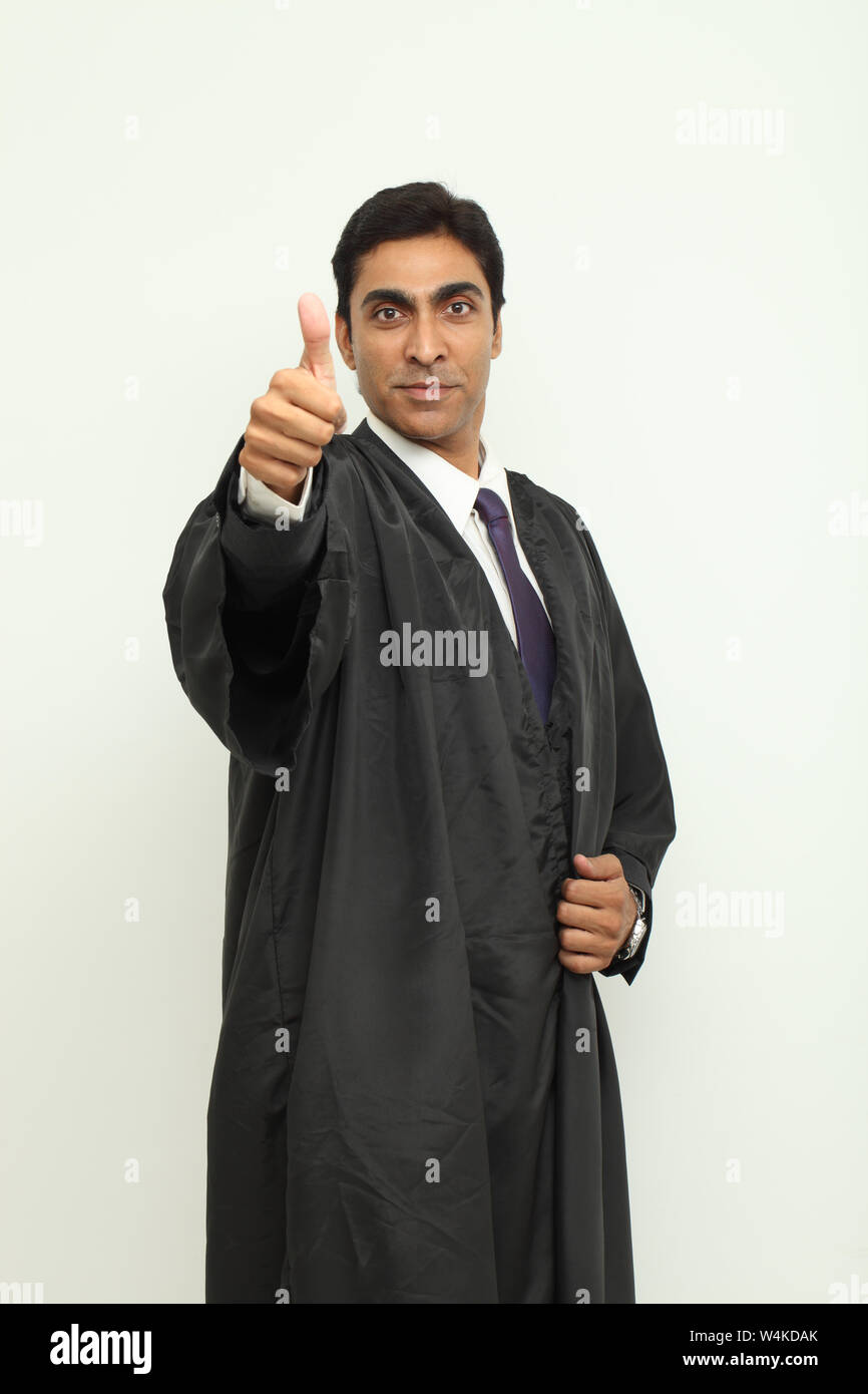 Lawyer showing thumbs up sign Stock Photo - Alamy