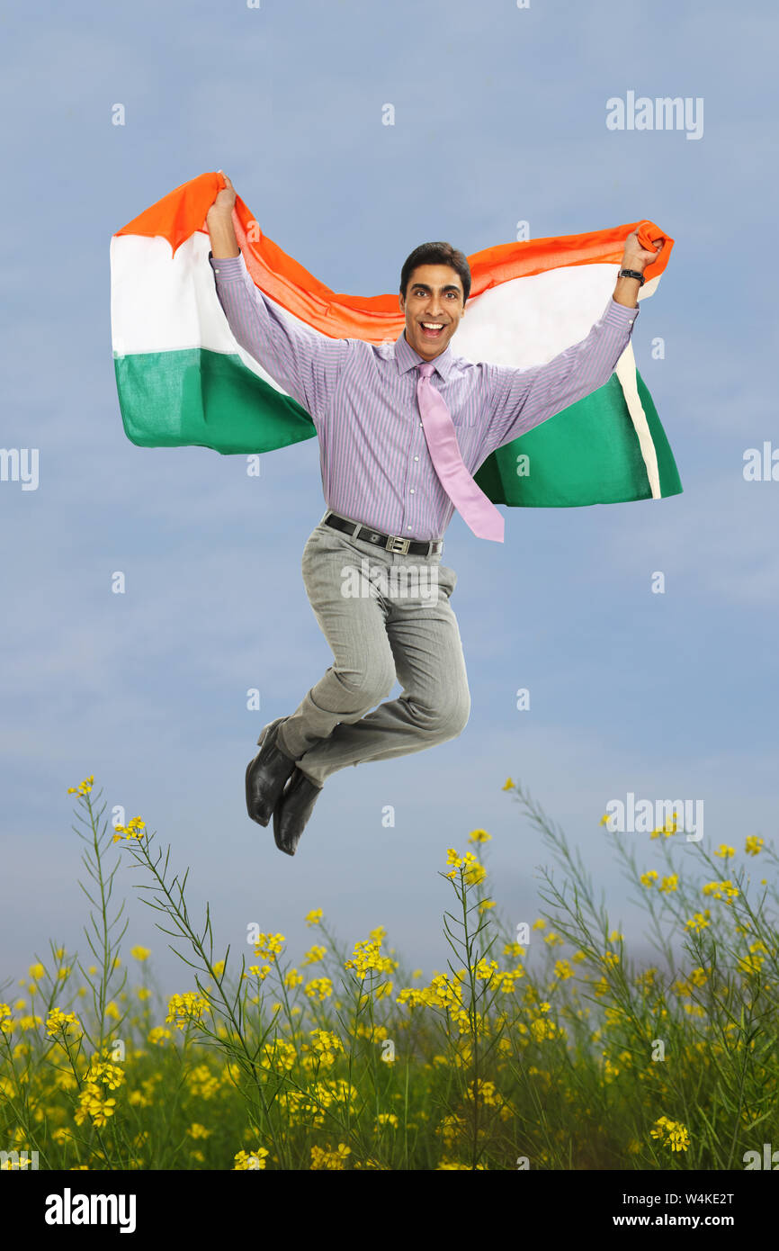 Businessman jumping with Indian Flag Stock Photo - Alamy