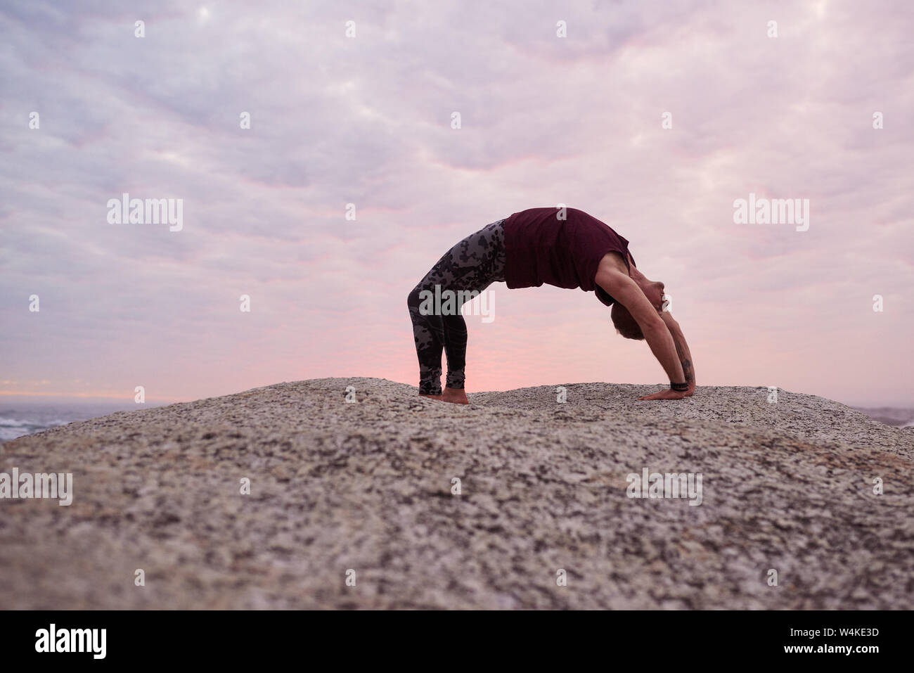 Doing wheel pose sunset hi-res stock photography and images - Alamy