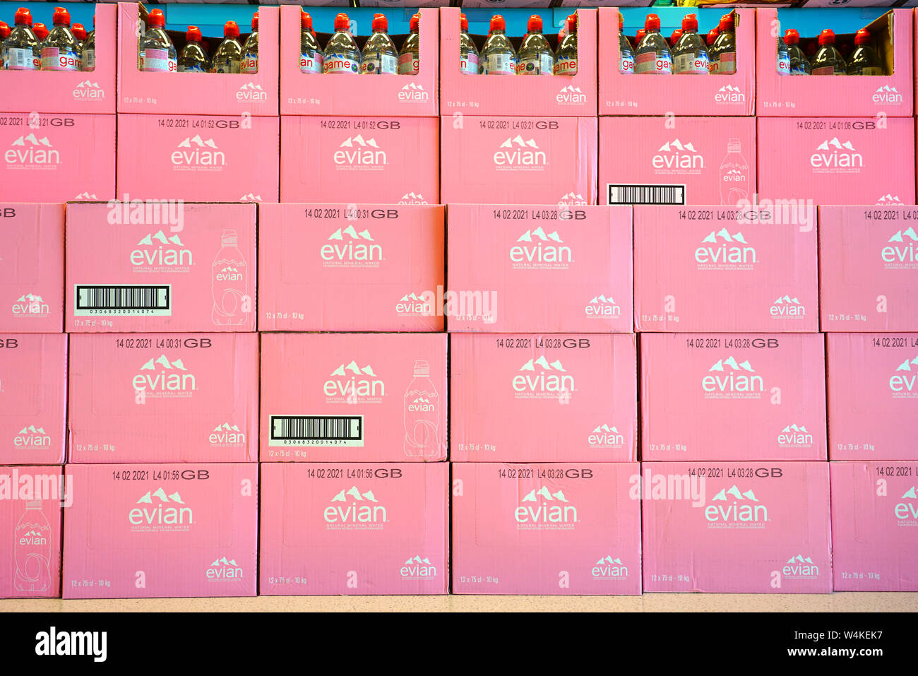 LONDON, ENGLAND -3 APR 2019- Pink carton boxes of plastic Evian water ...