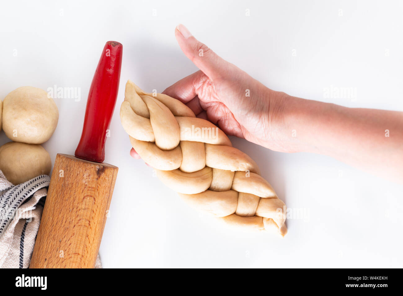 Homemade food concept process braiding bread braid challah dough on ...