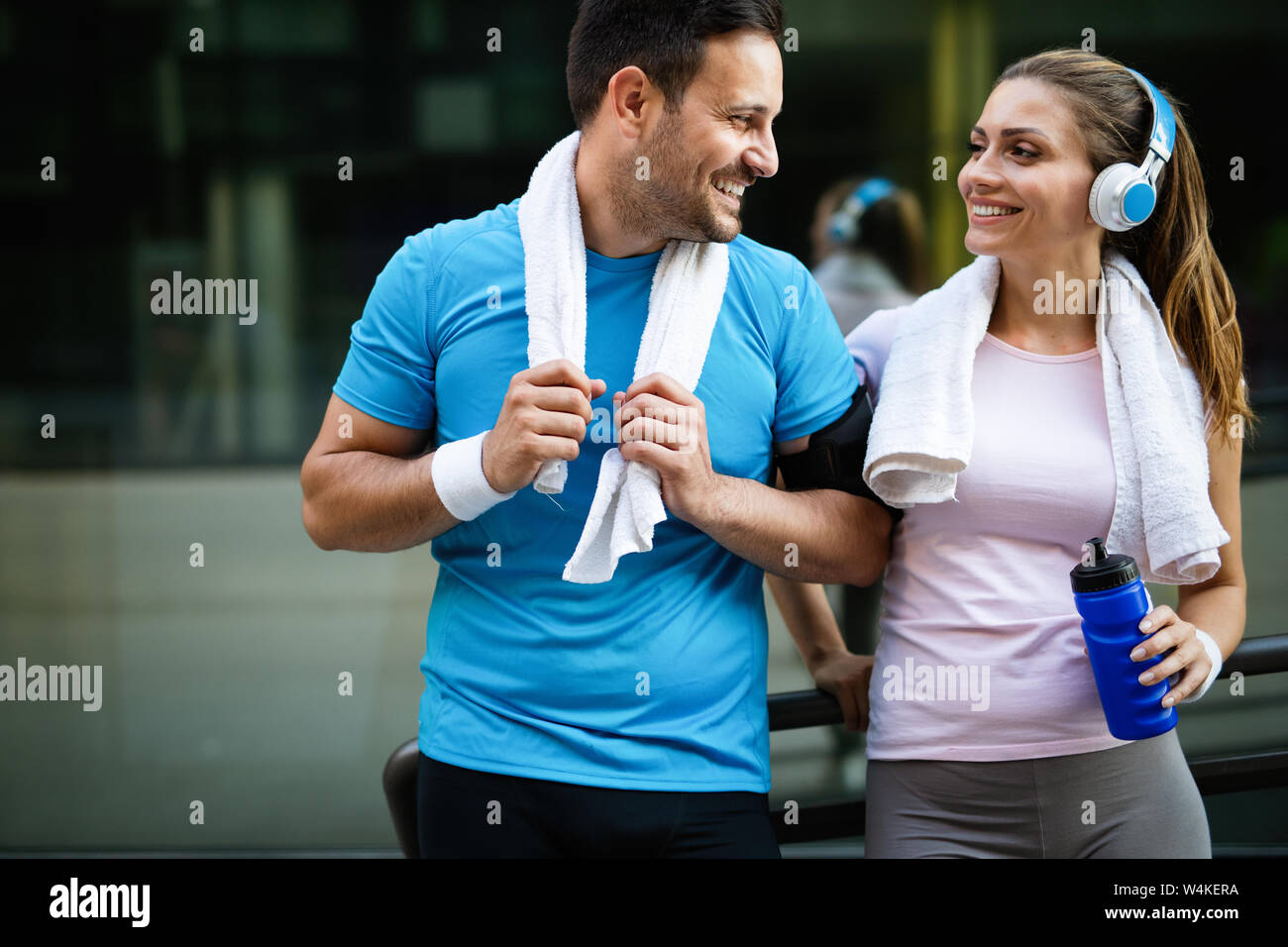 Fitness sporty couple relaxing after running training outside Stock Photo - Alamy