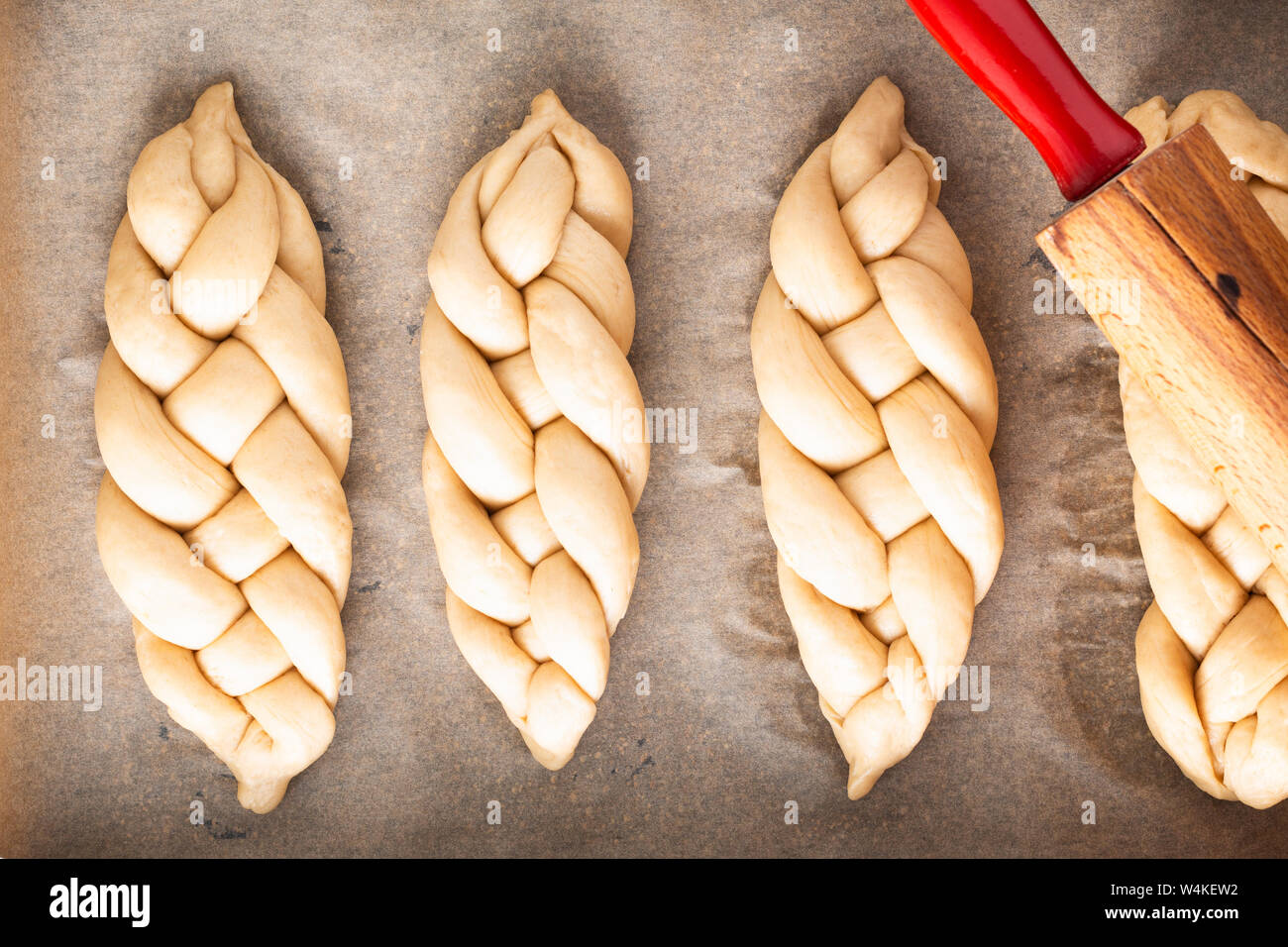 Homemade food concept process braiding bread braid challah dough on ...