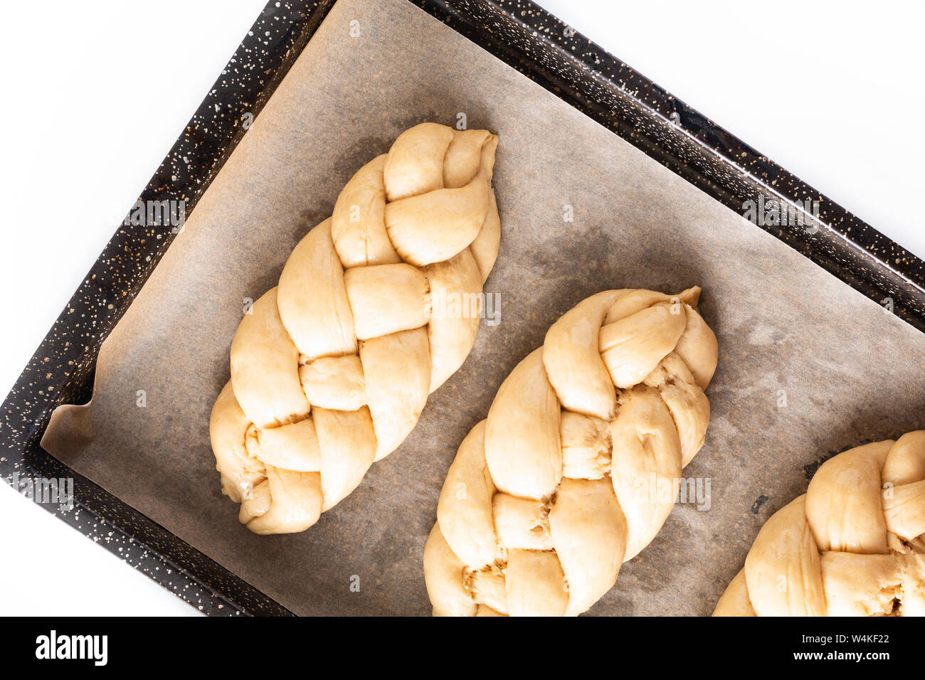 Homemade food concept process braiding bread braid challah dough on ...