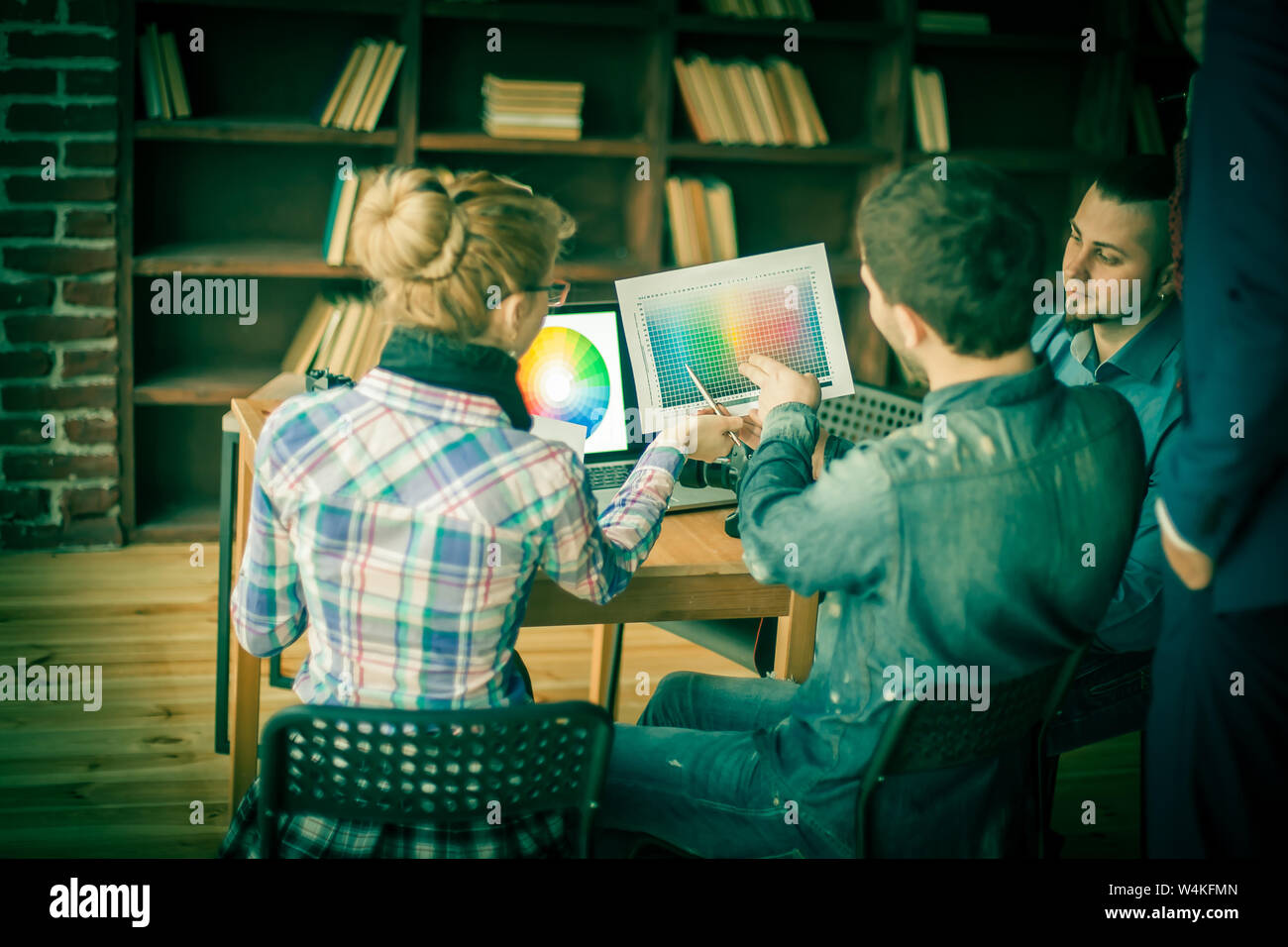 group of creative designers work with a new color palette in the ...