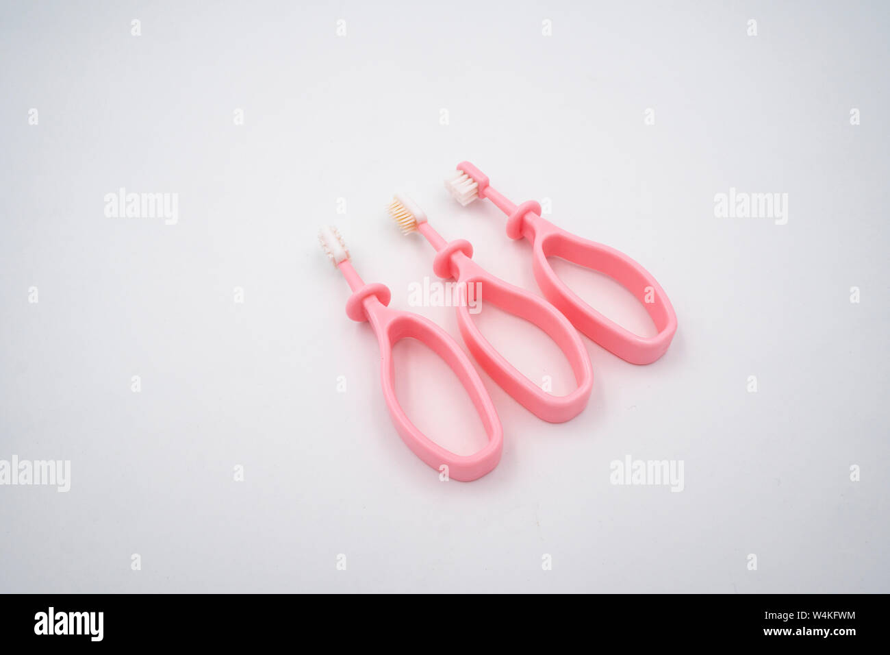 Baby 3 steps pink tooth brushes isolated on white background. Dental ...