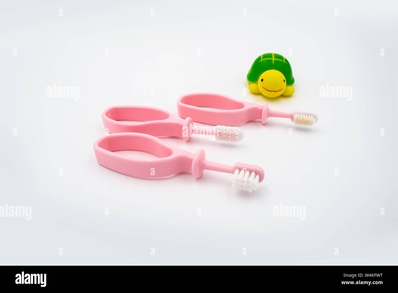 Baby 3 steps pink tooth brushes isolated on white background. Dental ...